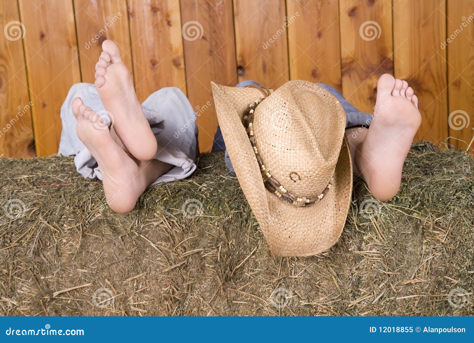 Feet and hat on hay stock image. Image of feet, youth - 12018855