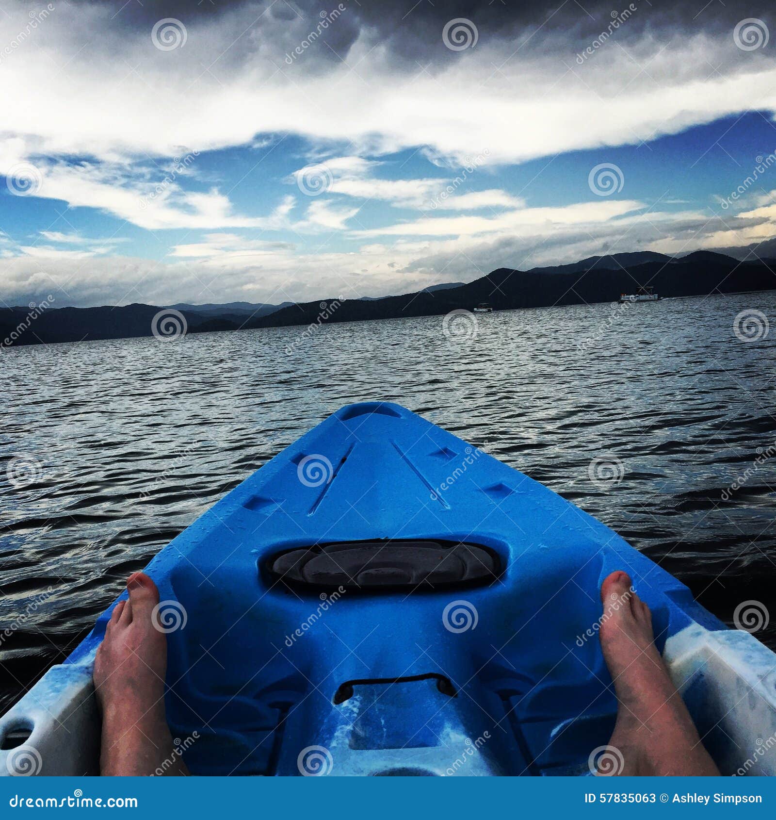 Feet in kayak in water stock image. Image of kayak, clouds - 57835063