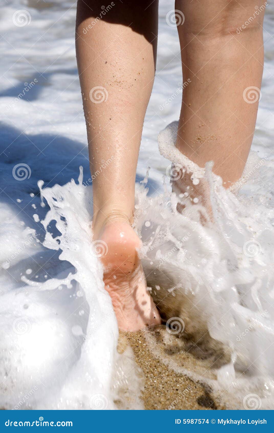 Feet are in a marine wave stock photo. Image of close - 5987574