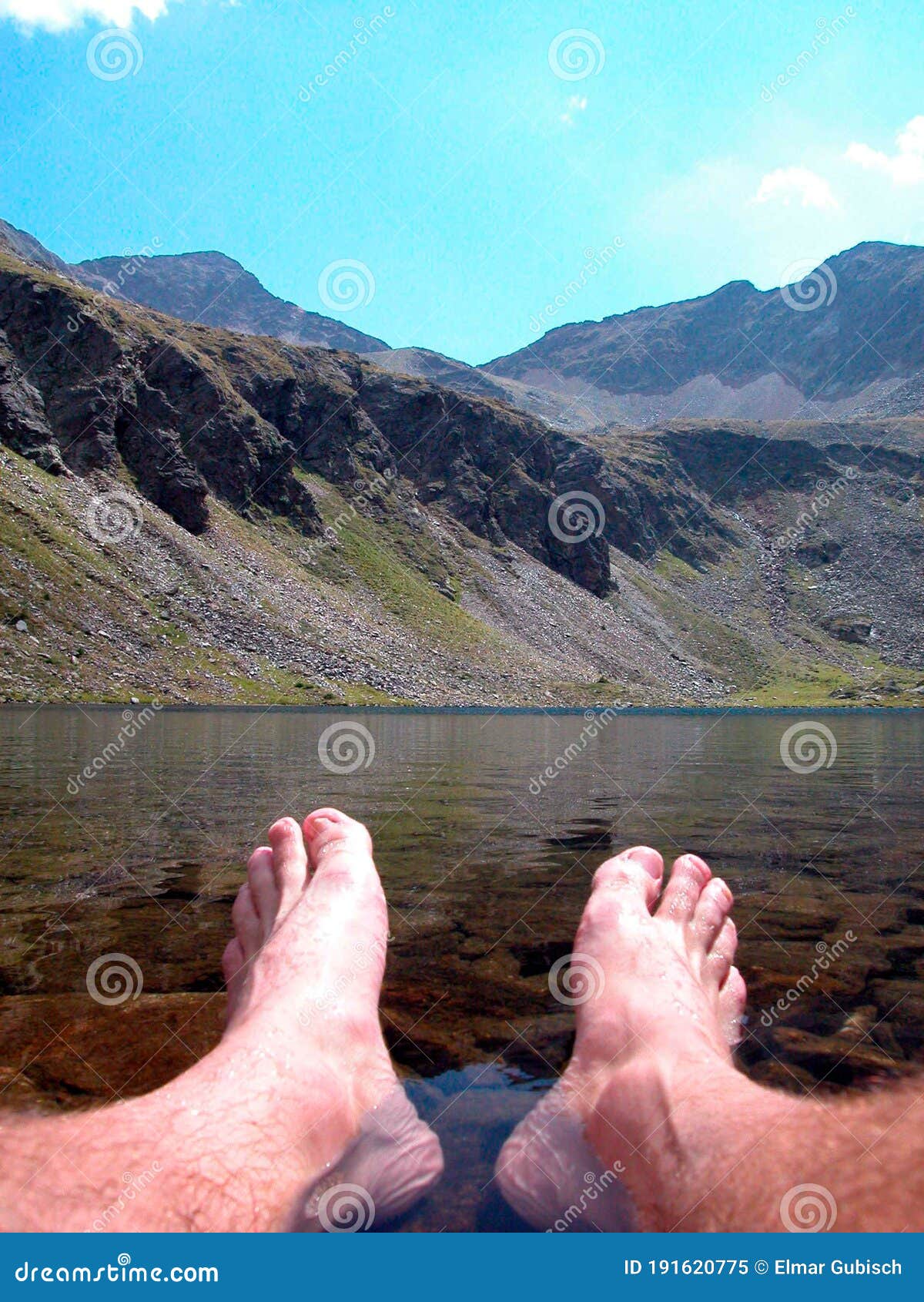 Feet in a mountain lake stock image. Image of fitness - 191620775