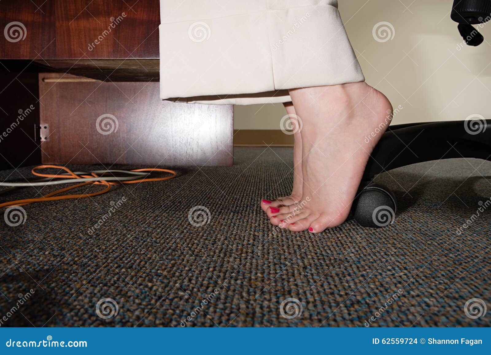 Feet of an office worker stock photo. Image of cable - 62559724