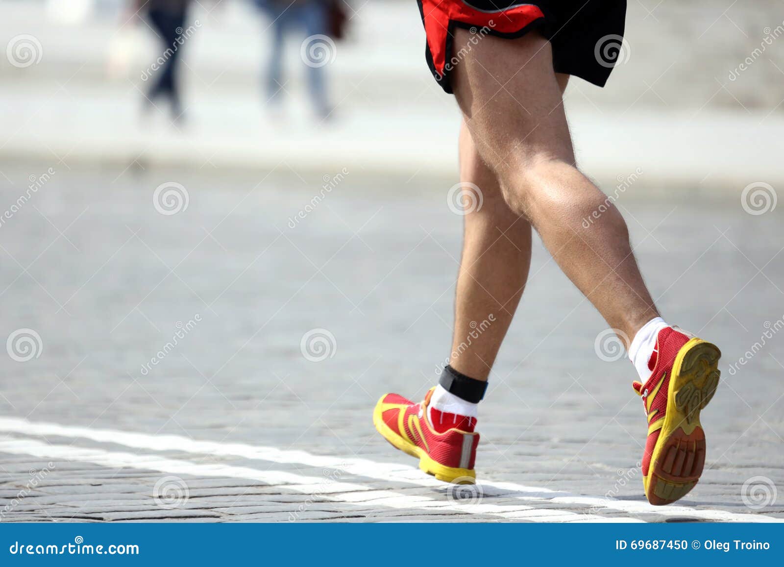 Feet Running Distance Athlete on the Stone Pavement Stock Photo - Image ...