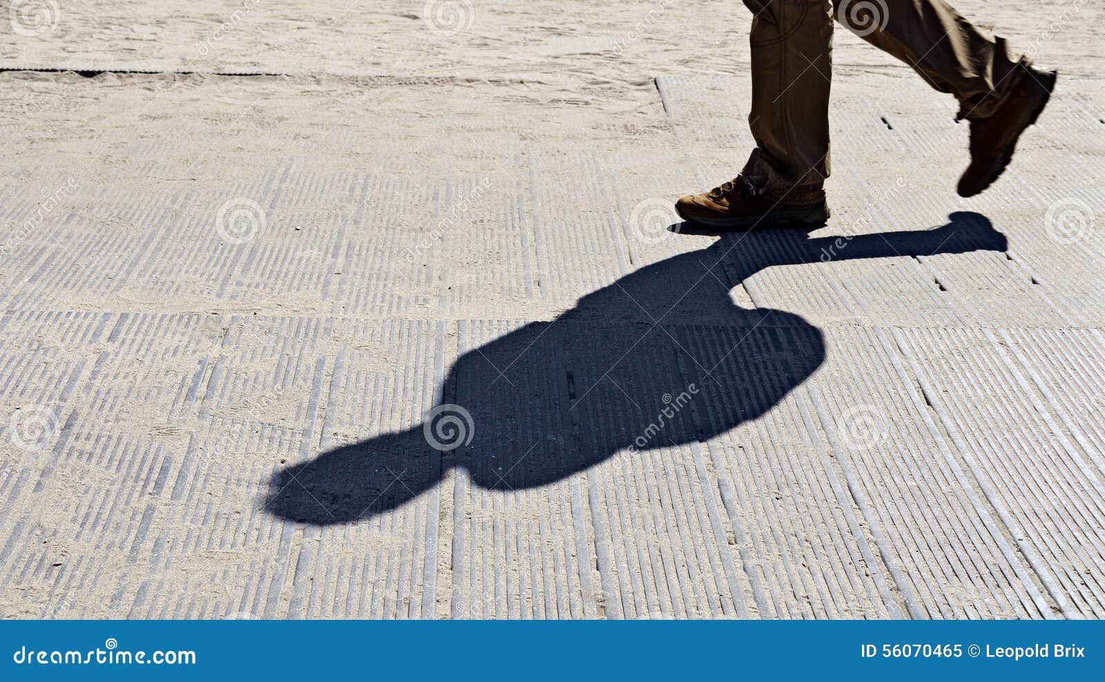 Feet and Shadow of a Walker Stock Image - Image of zingst, shoes: 56070465