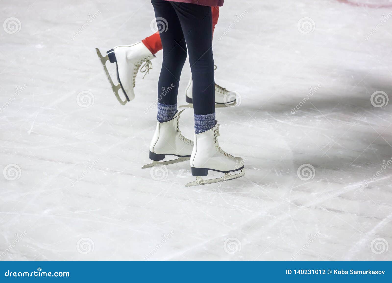 Feet on the Skates of a Person Rolling on the Ice Rink Stock Photo ...