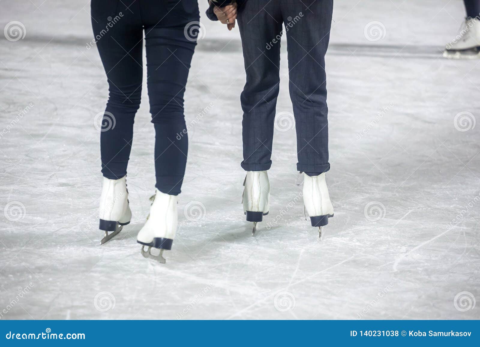 Feet on the Skates of a Person Rolling on the Ice Rink Stock Photo ...