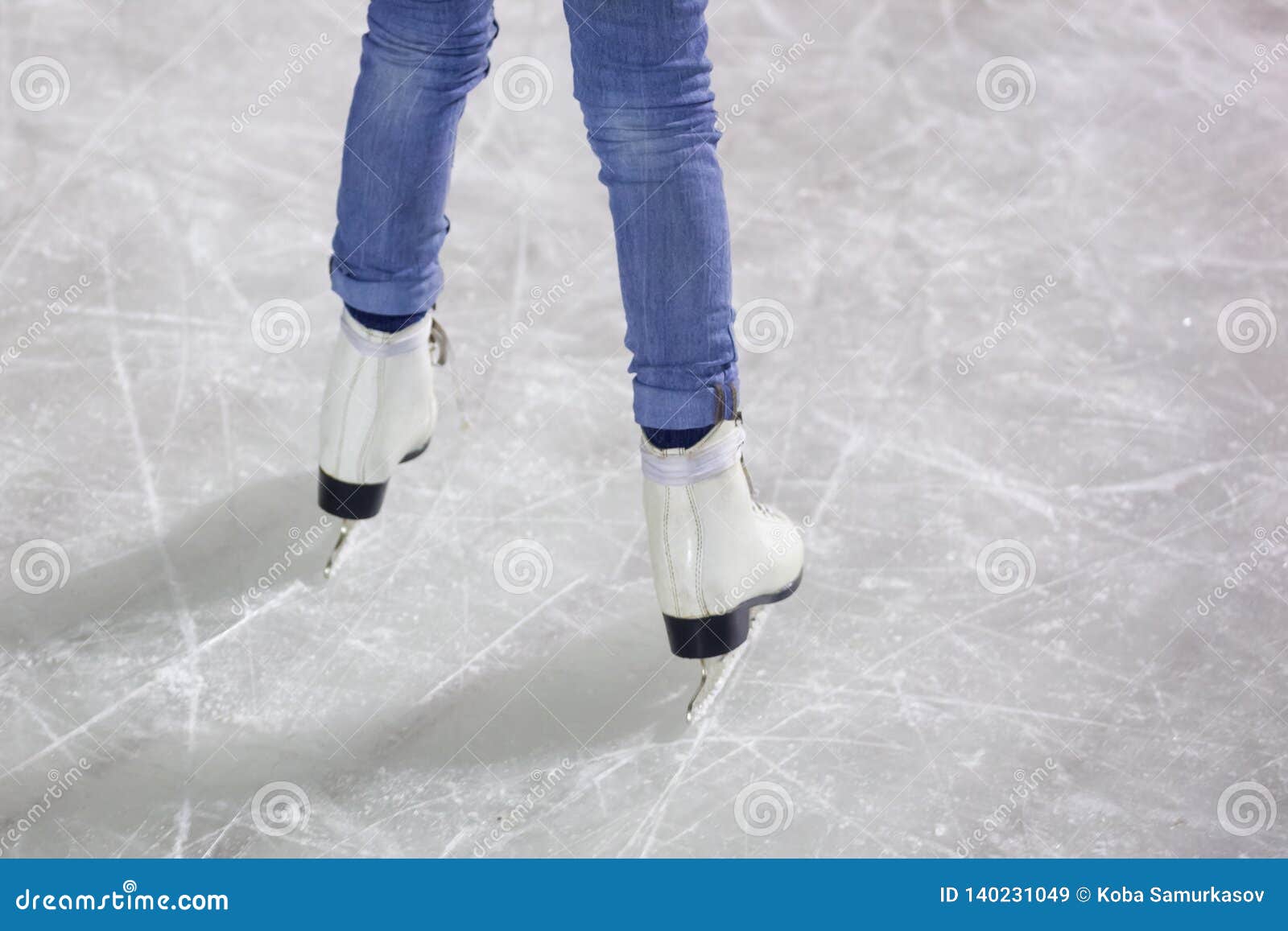 Feet on the Skates of a Person Rolling on the Ice Rink Stock Image ...