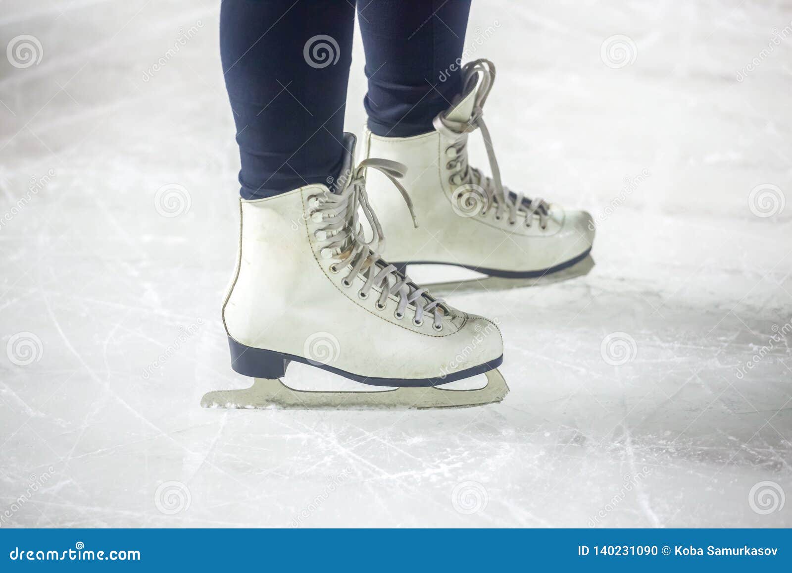 Feet on the Skates of a Person Rolling on the Ice Rink Stock Photo ...