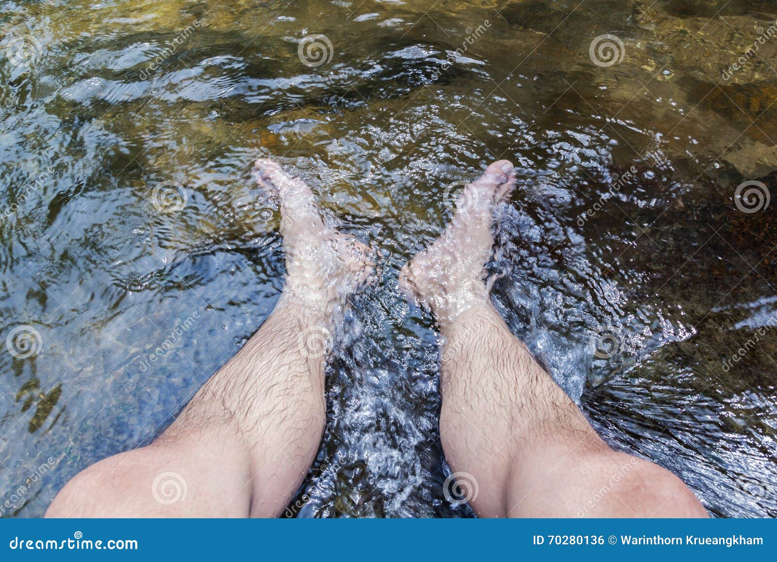 Feet soaking in the water stock photo. Image of background - 70280136
