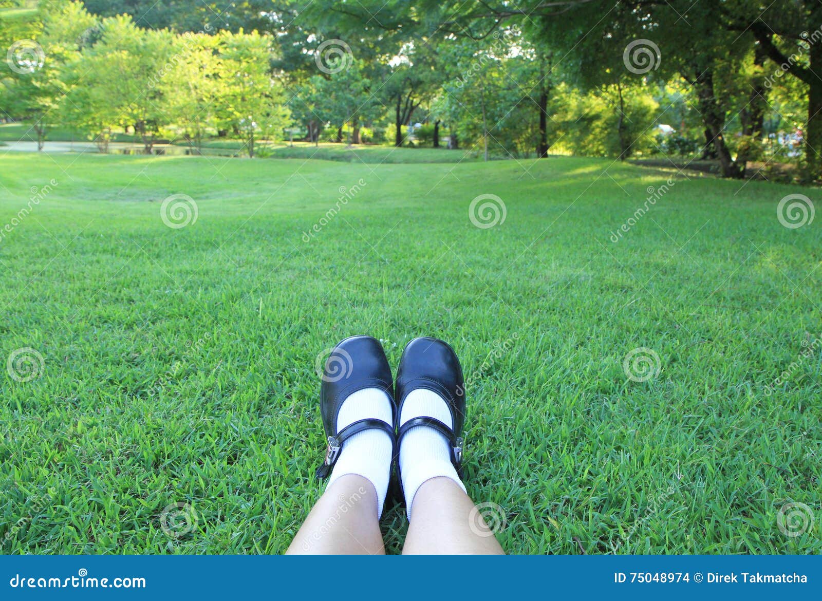 Feet in Student Shoes on Green Field Stock Photo - Image of outdoors ...