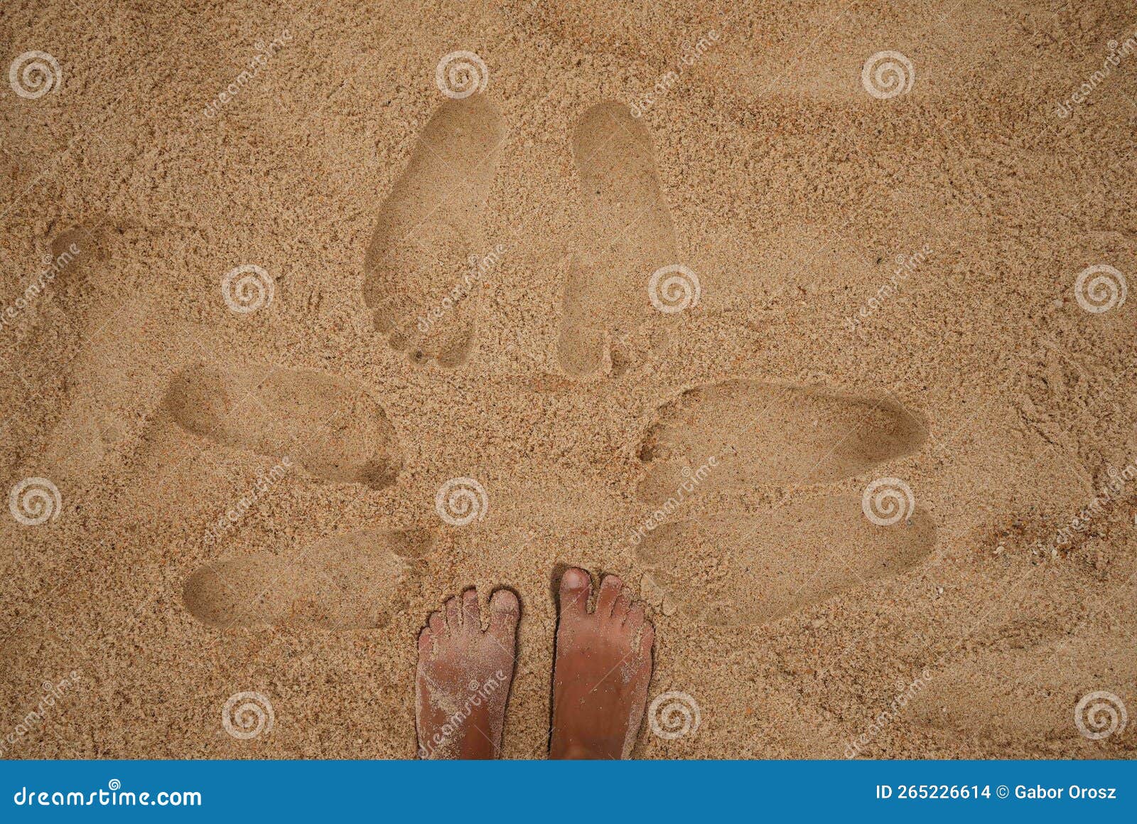 Feet and Three Footprints in the Sand Stock Photo - Image of stand ...