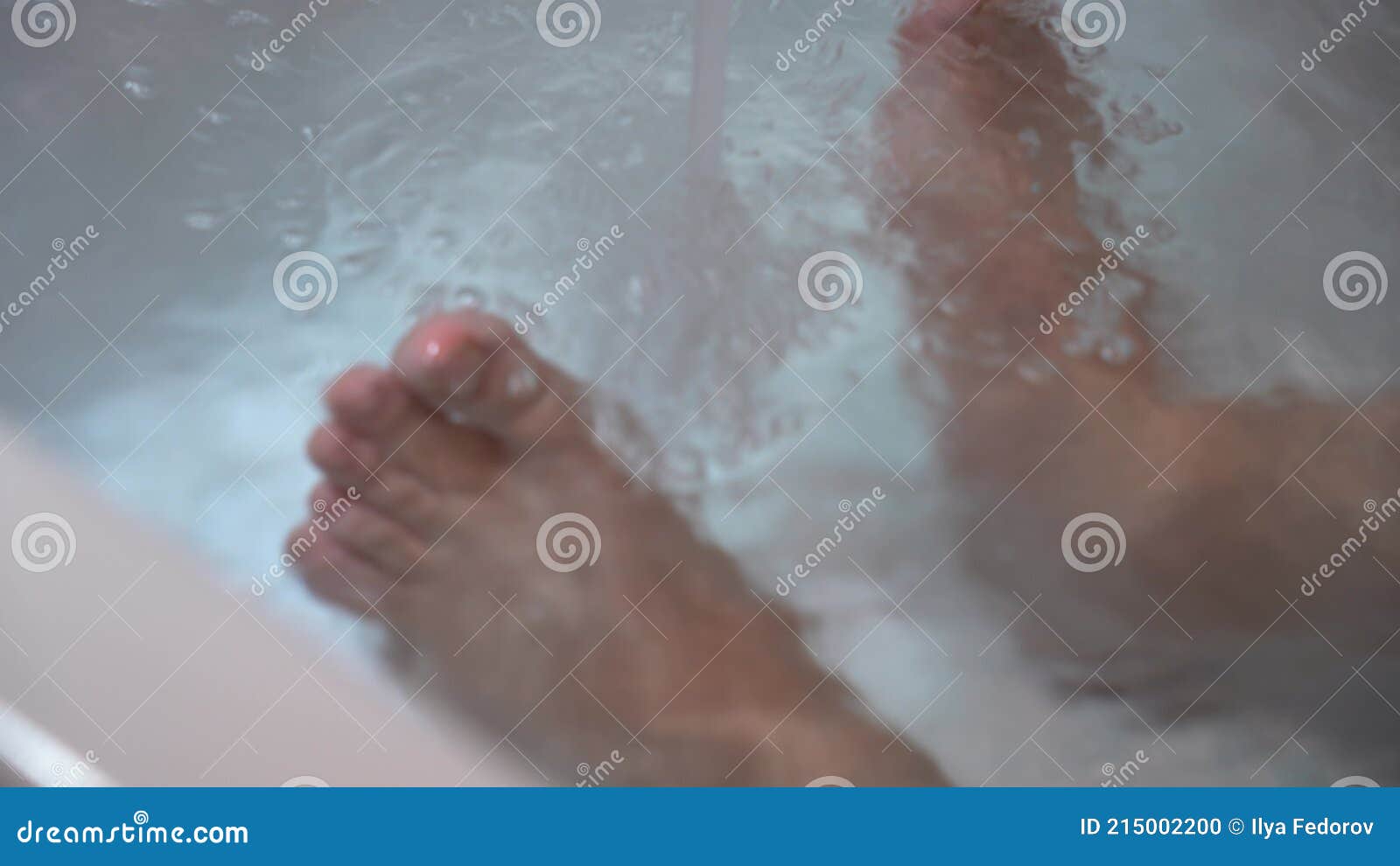 Feet Underwater in the Bath. Bathroom Water Bubbles with Tap Water ...