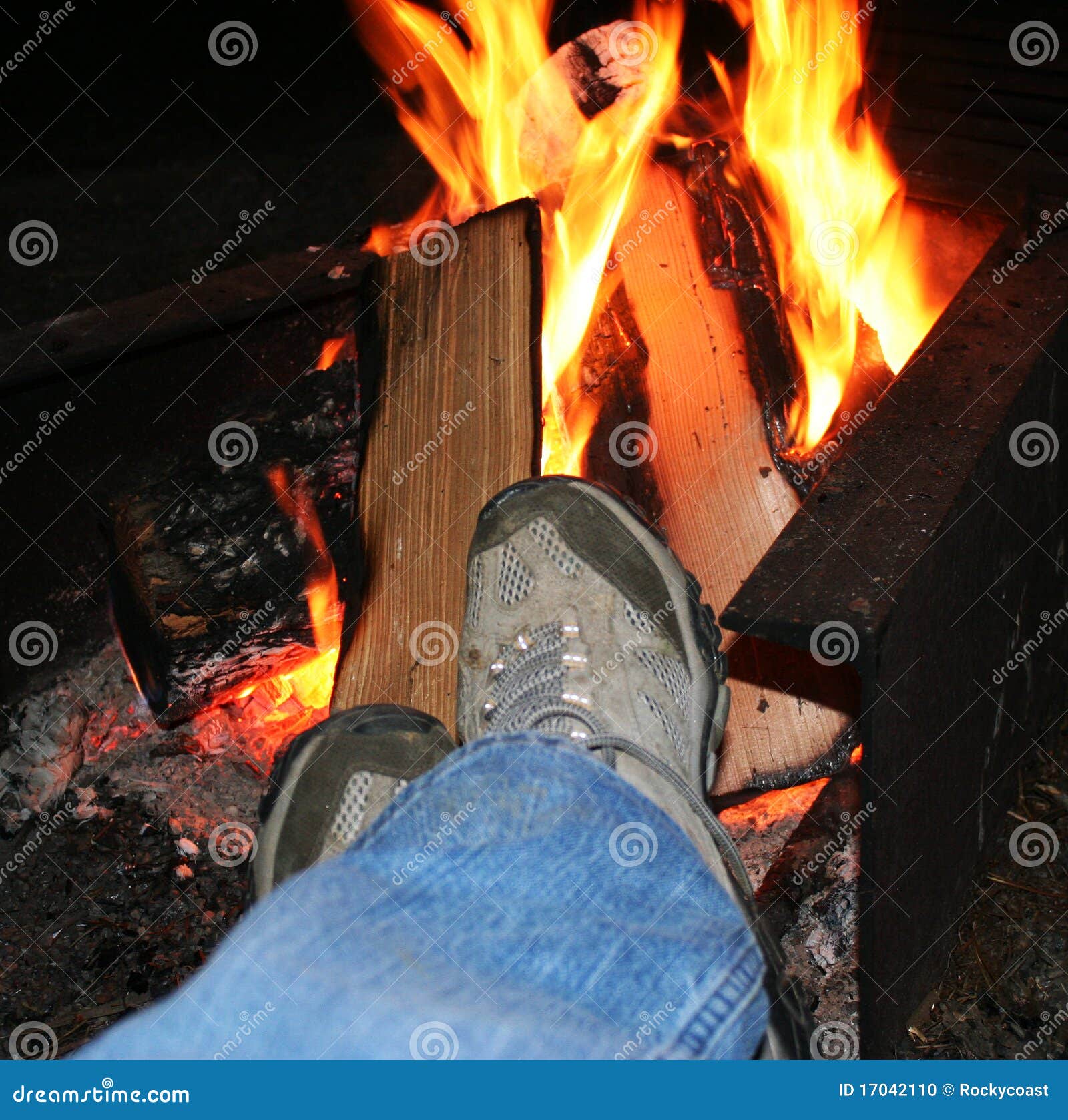 Feet Warming At A Camp Fire Stock Photo - Image of orange, ember: 17042110