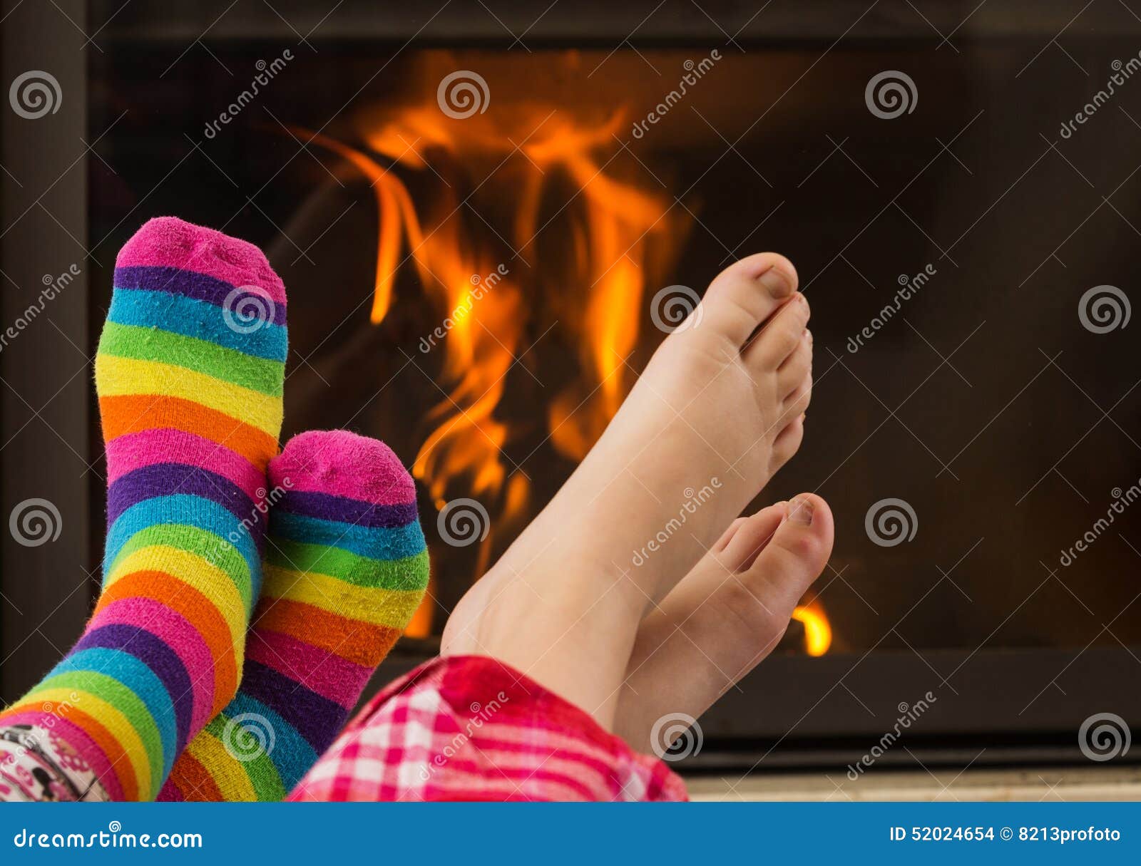 Feet warming by fireplace stock photo. Image of pairs - 52024654