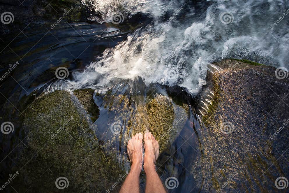 Feet in waterfall stock photo. Image of brook, drops - 45301500