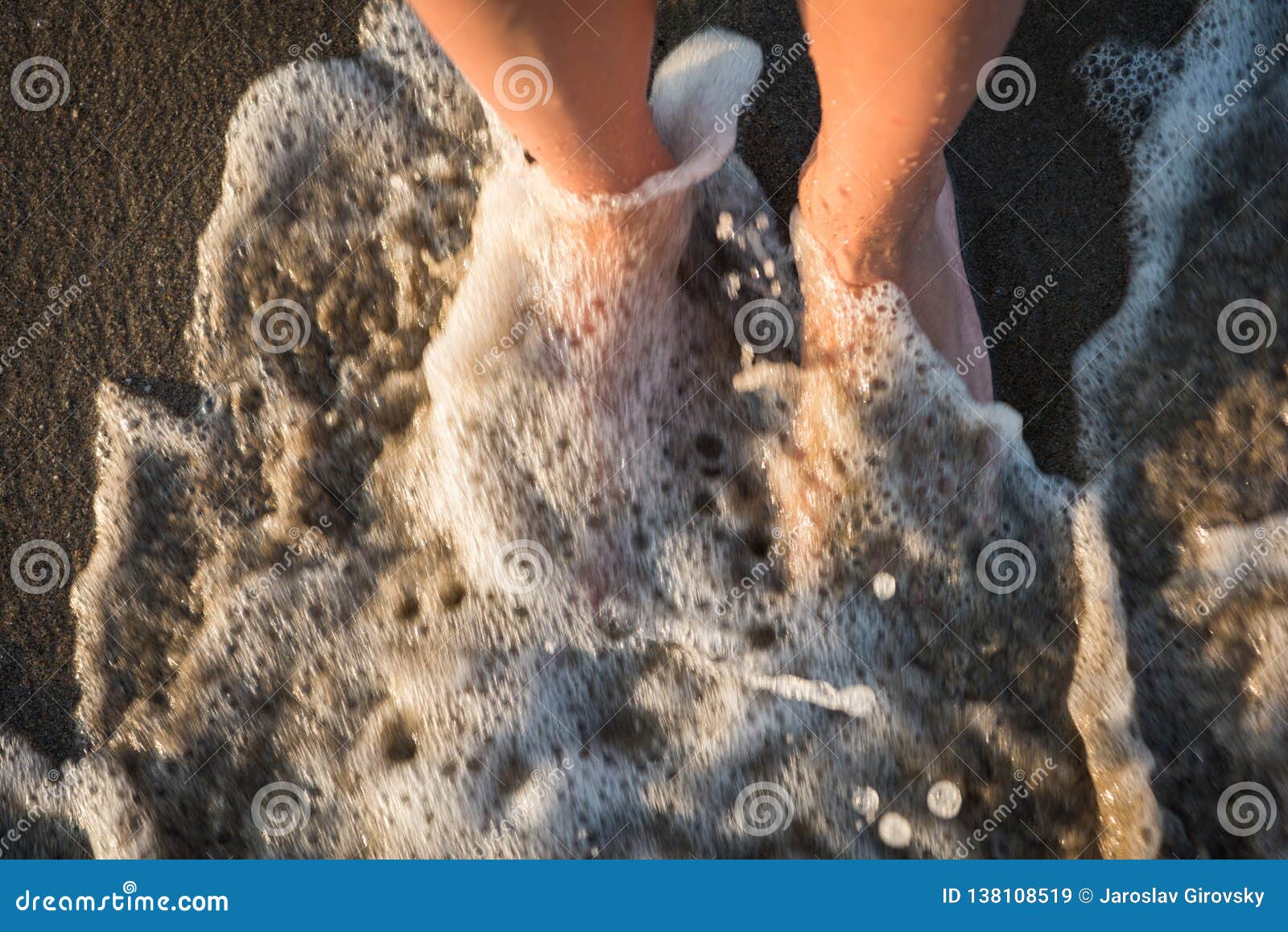 Feet and waves stock image. Image of ocean, standing - 138108519