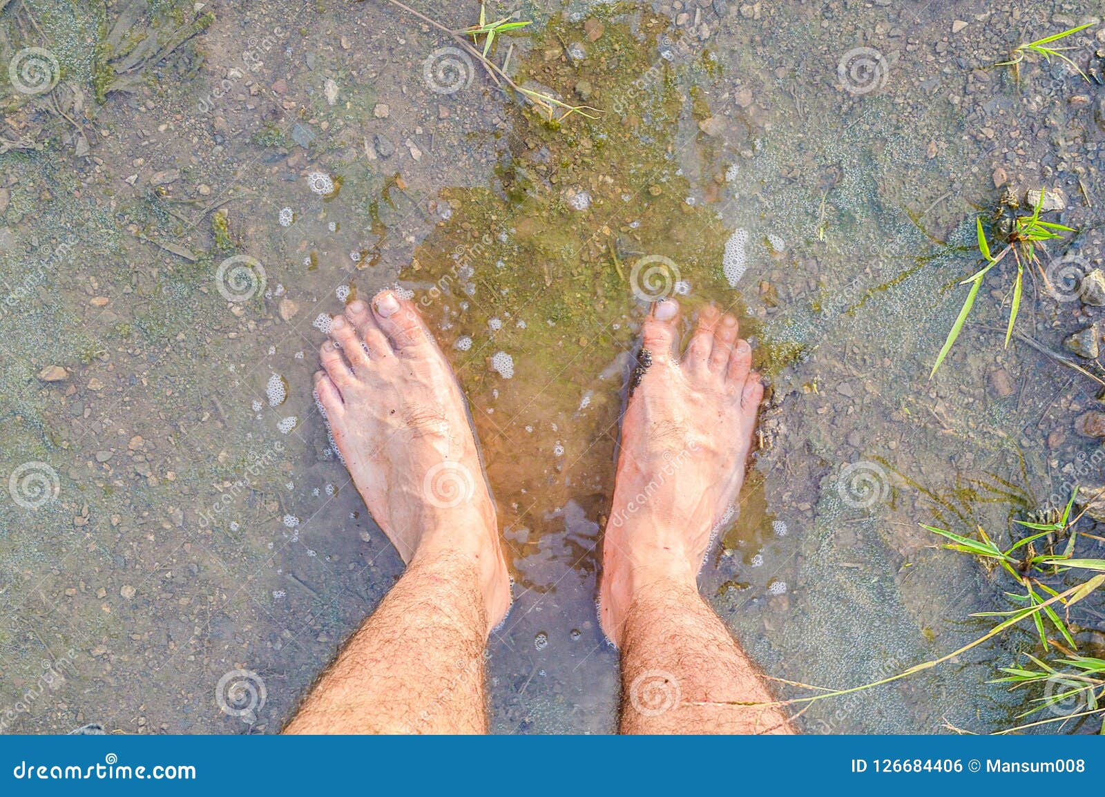 Feet on wet soil stock photo. Image of body, natural - 126684406