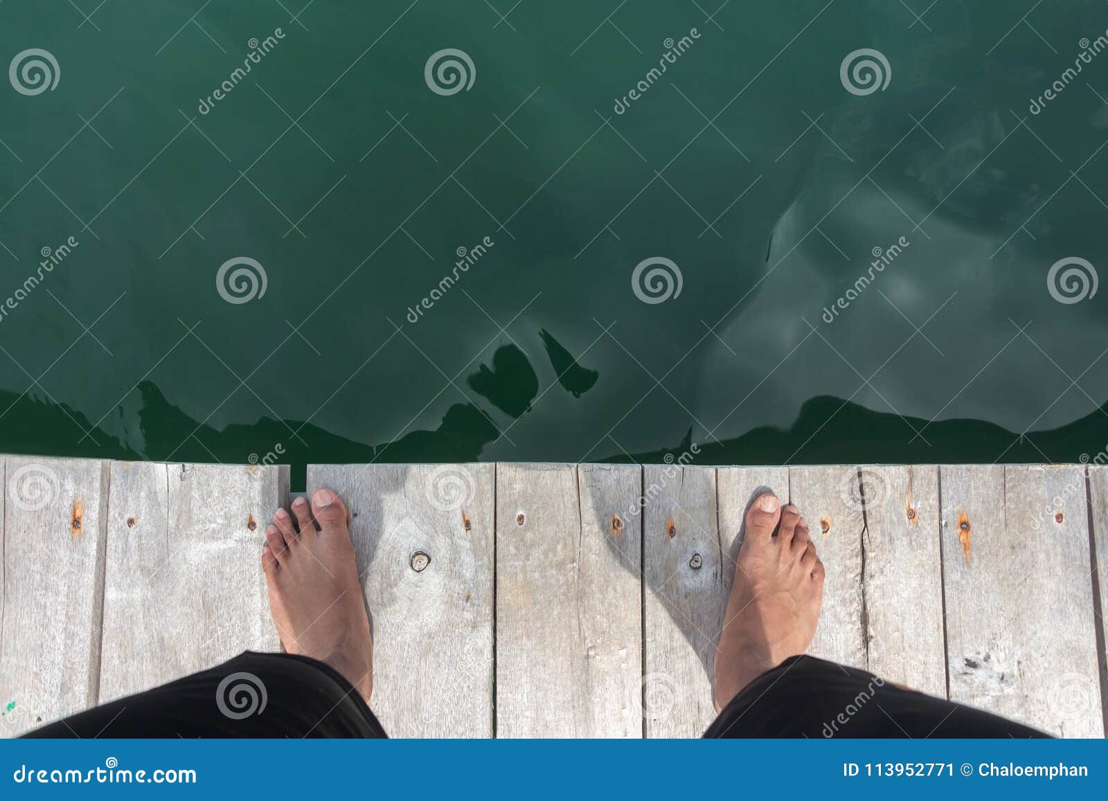 Feet on the wooden bridge stock image. Image of relax - 113952771