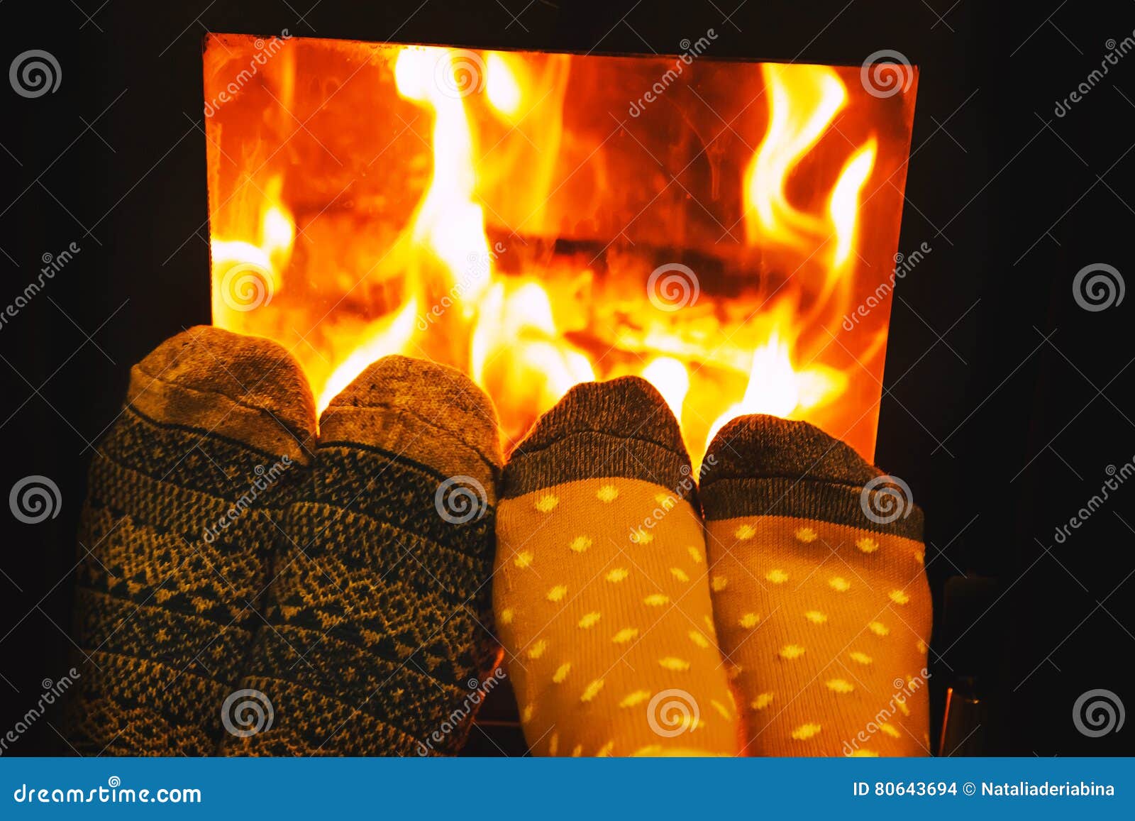 Feet in Wool Socks of Couple Lovers Warming by Cozy Fire. Stock Photo ...