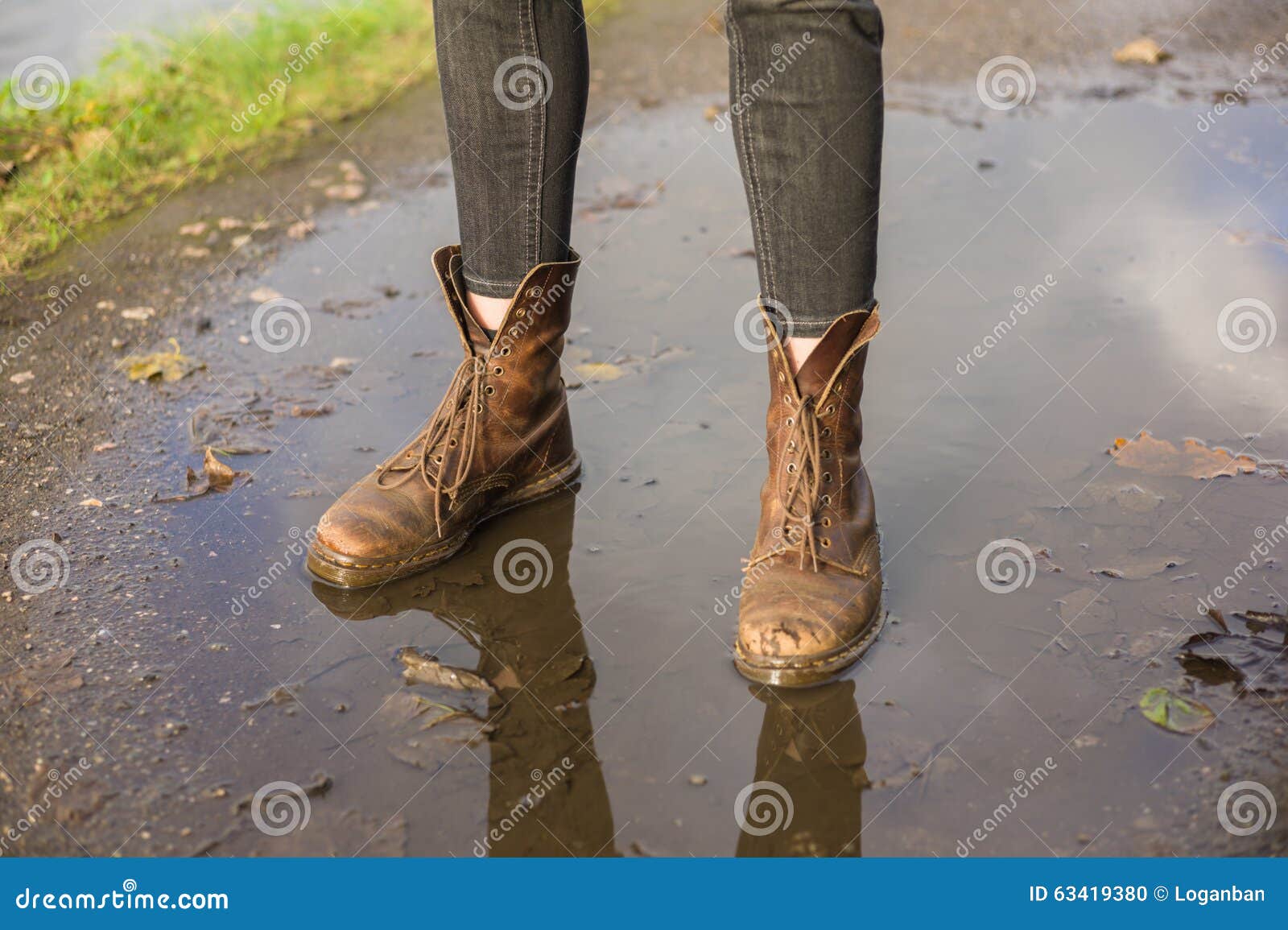 Feet of Young Person Standing in Puddle Stock Photo - Image of shoes ...