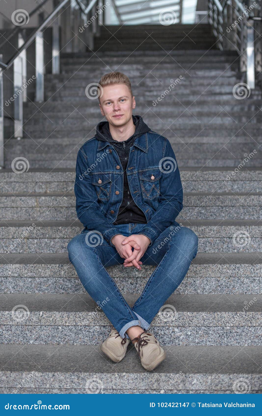 Fellow is Sitting on Stairs in Jeans and Jeans Jacket Stock Image ...