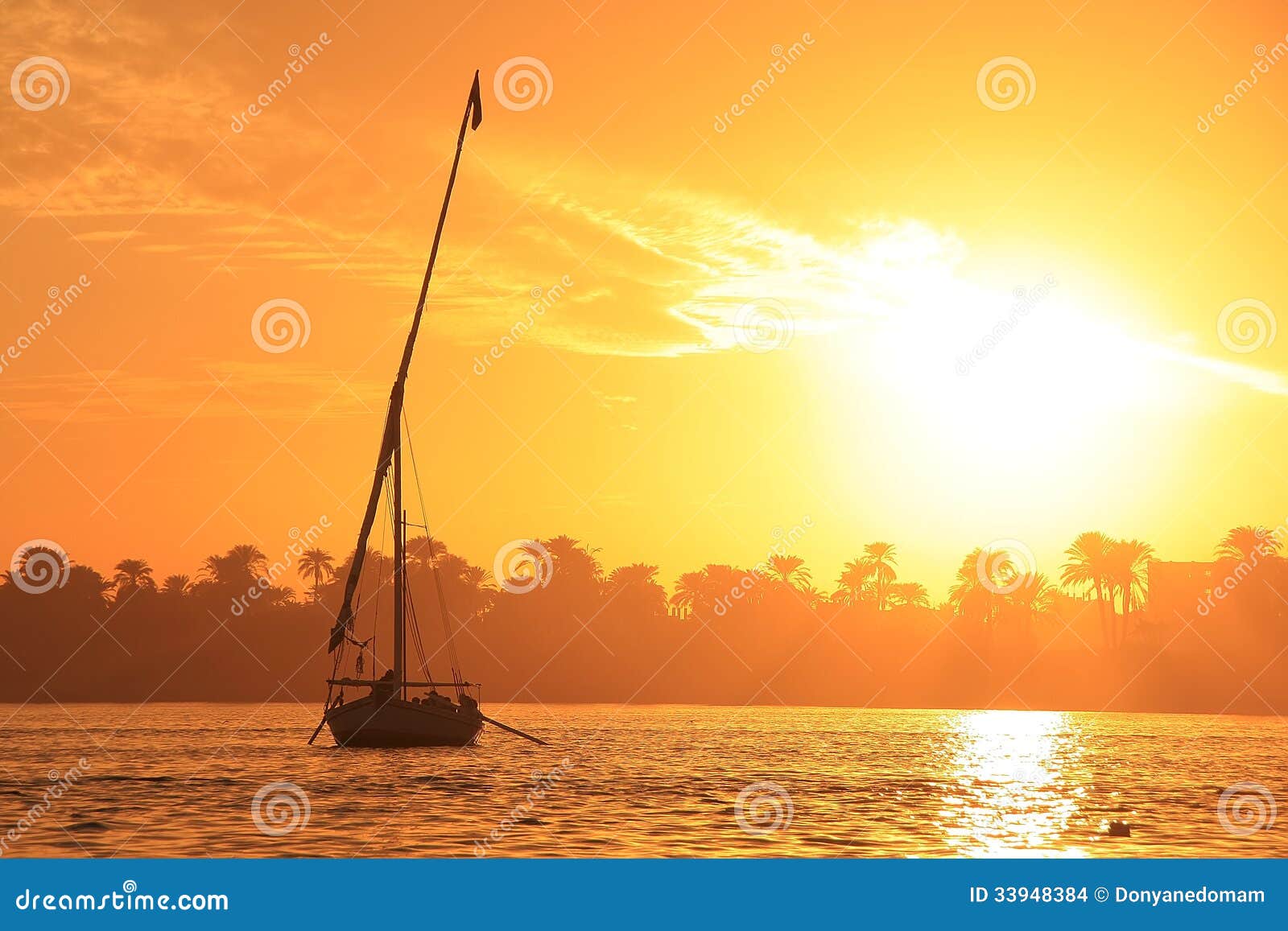 Felucca Boat Sailing on the Nile River at Sunset, Luxor Stock Photo ...