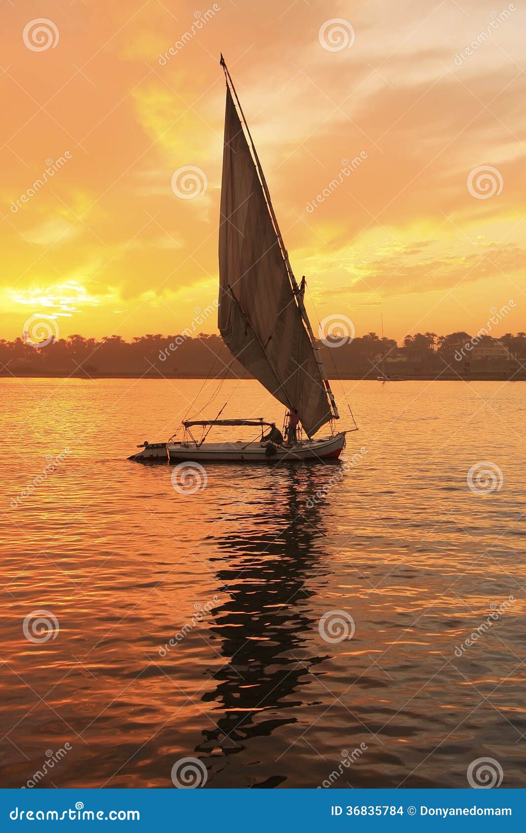 Felucca Boat Sailing on the Nile River at Sunset, Luxor Stock Photo ...