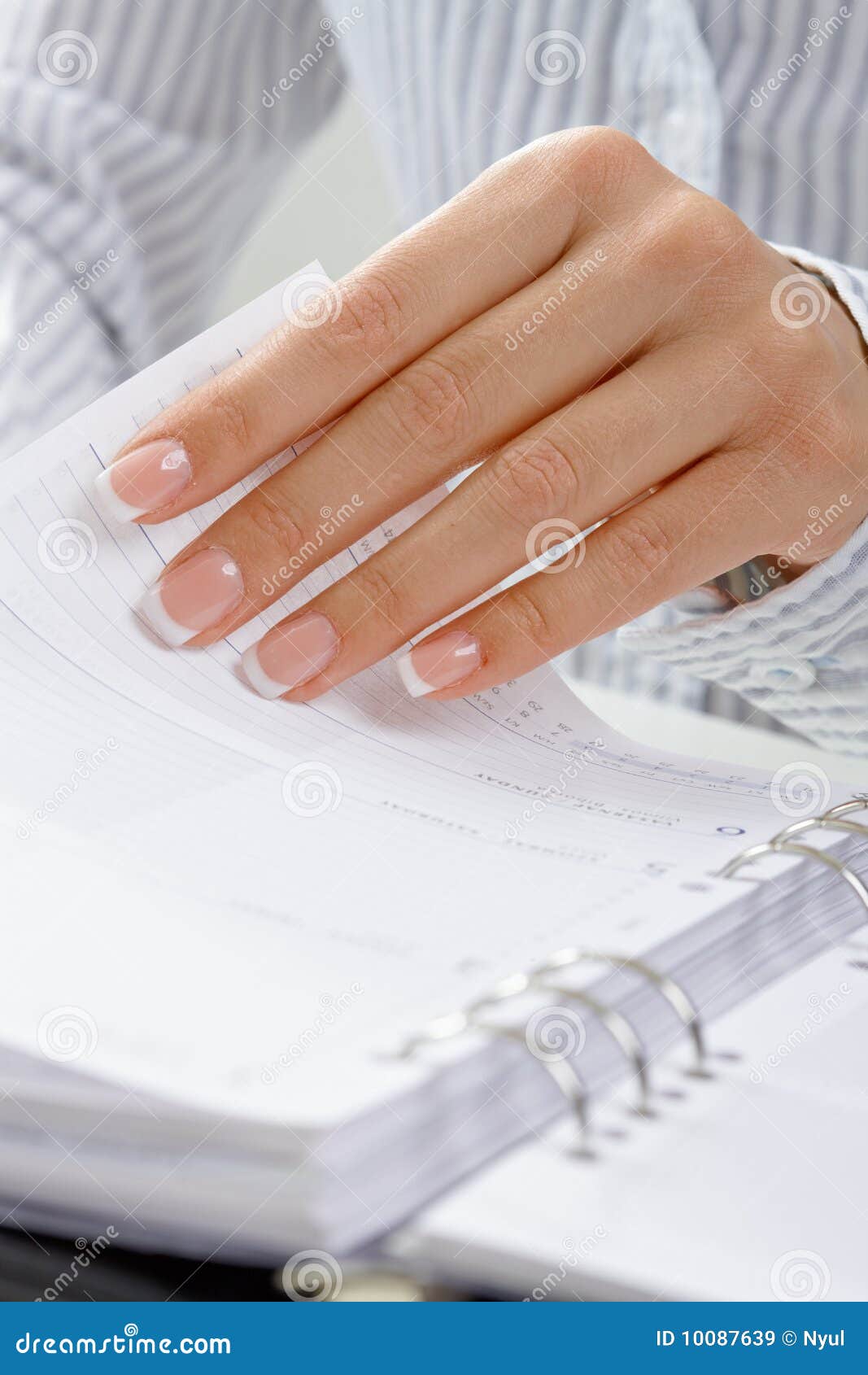 Femal hand turning page stock image. Image of finger - 10087639