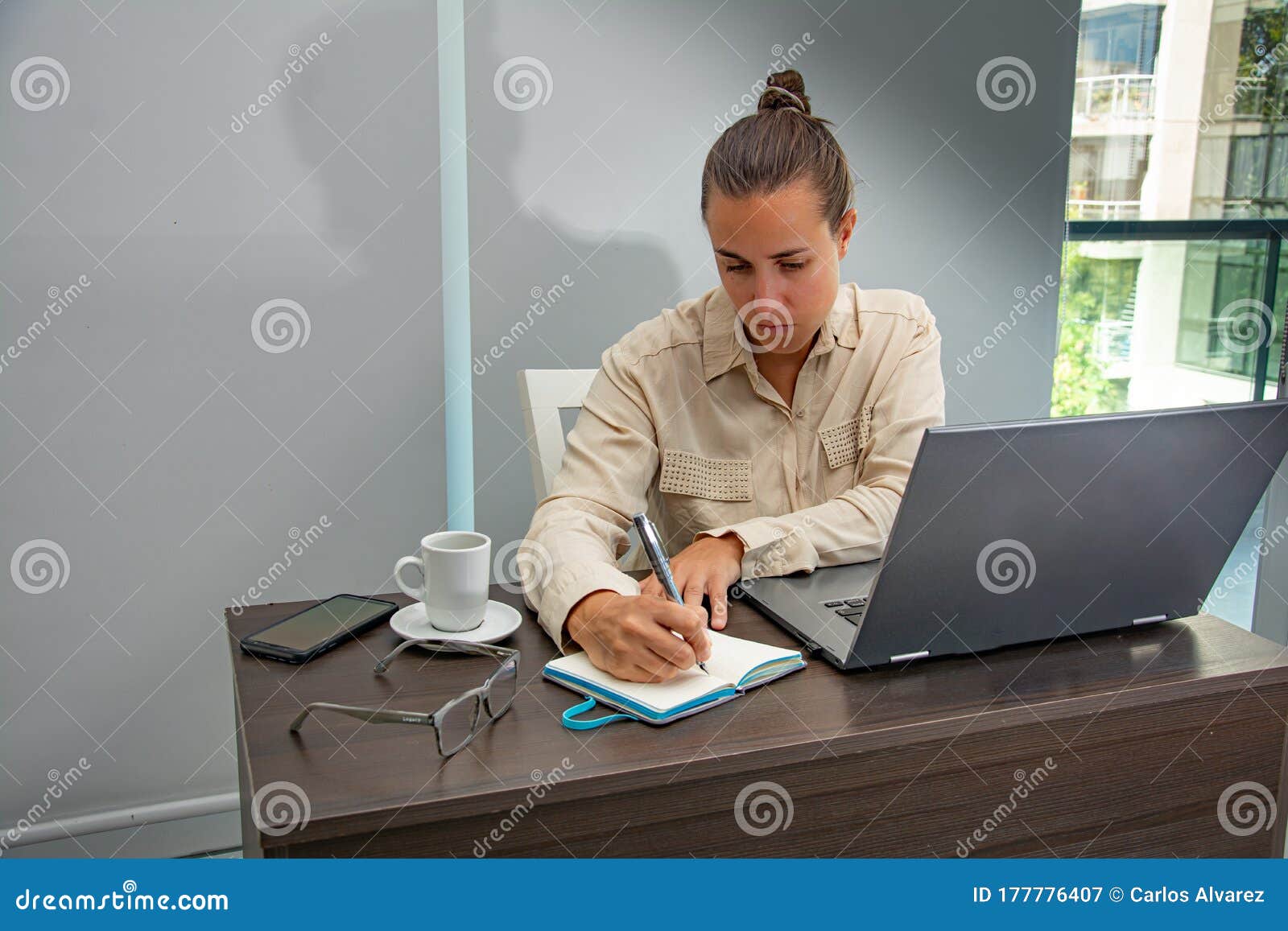 Female Administrative Working in the Office and Taking Notes Stock ...