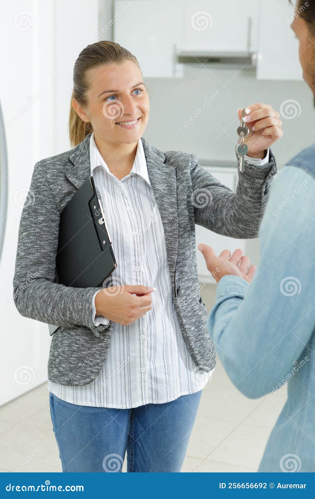 Female Agent Giving Key To Male Client Stock Photo - Image of house ...
