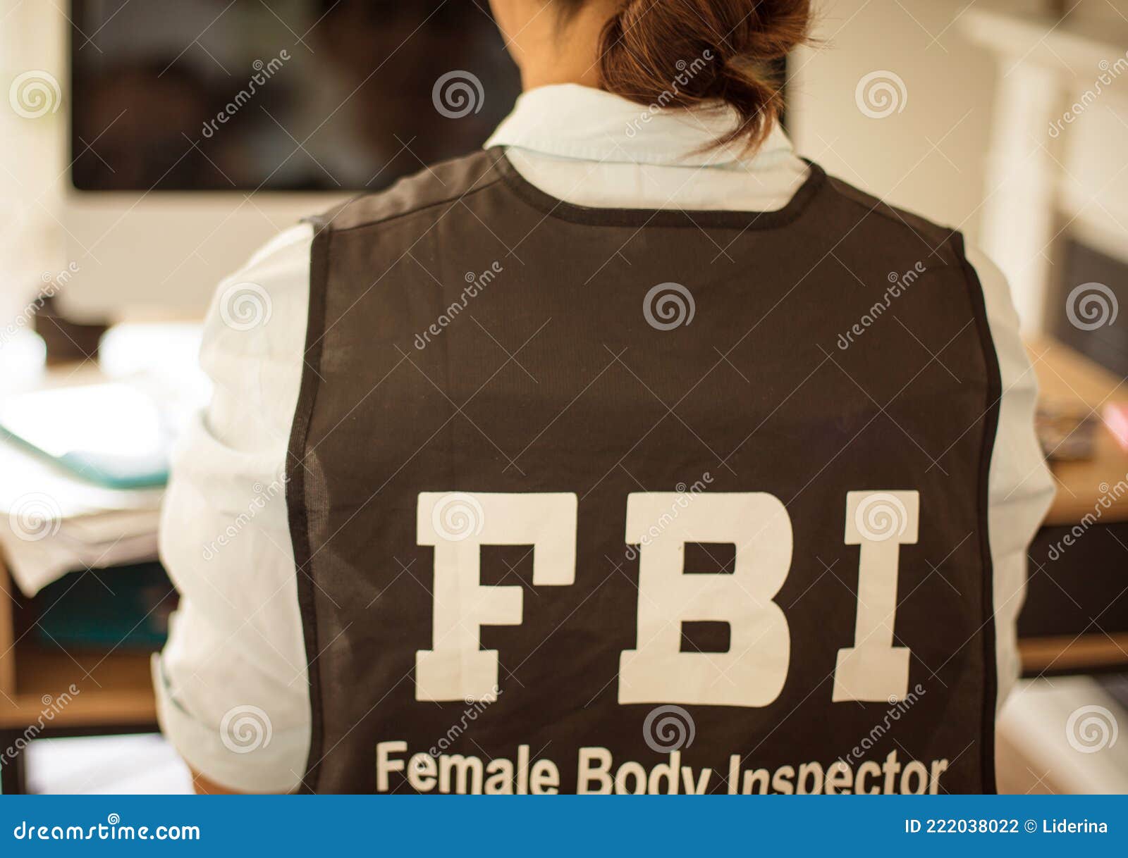 FBI Female Working Agent in Her Office. Focus is on Foreground Female ...