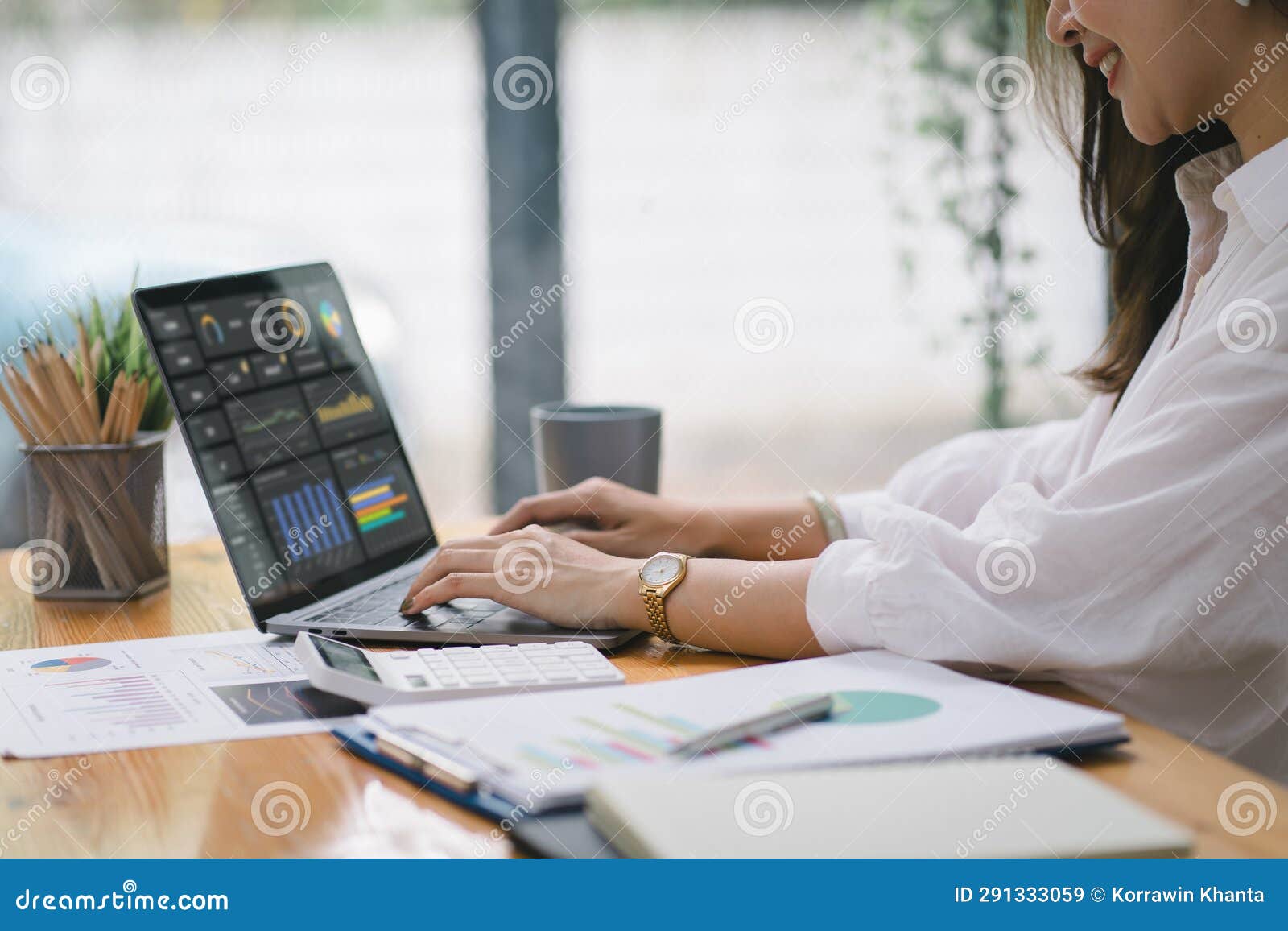 The Female Analyst Utilizes a Computer and a Dashboard for Business ...