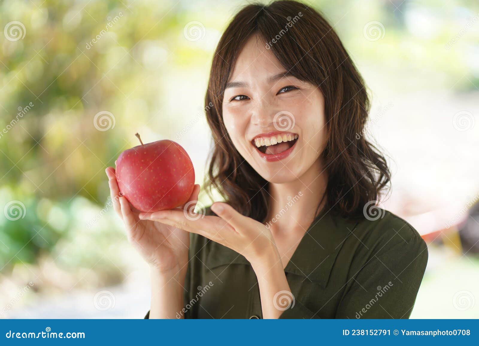 Female with an apple stock image. Image of woman, outdoor - 238152791