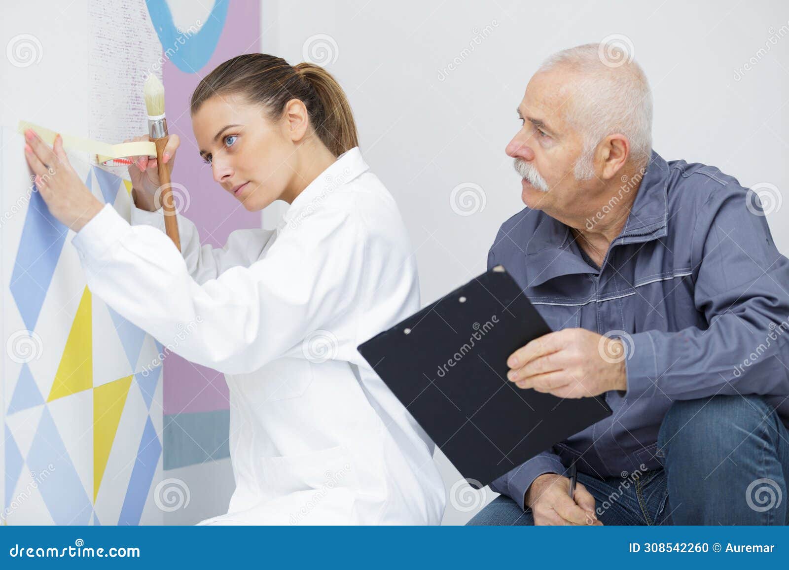Female Apprentice Being Looked by Teacher Stock Photo - Image of people ...