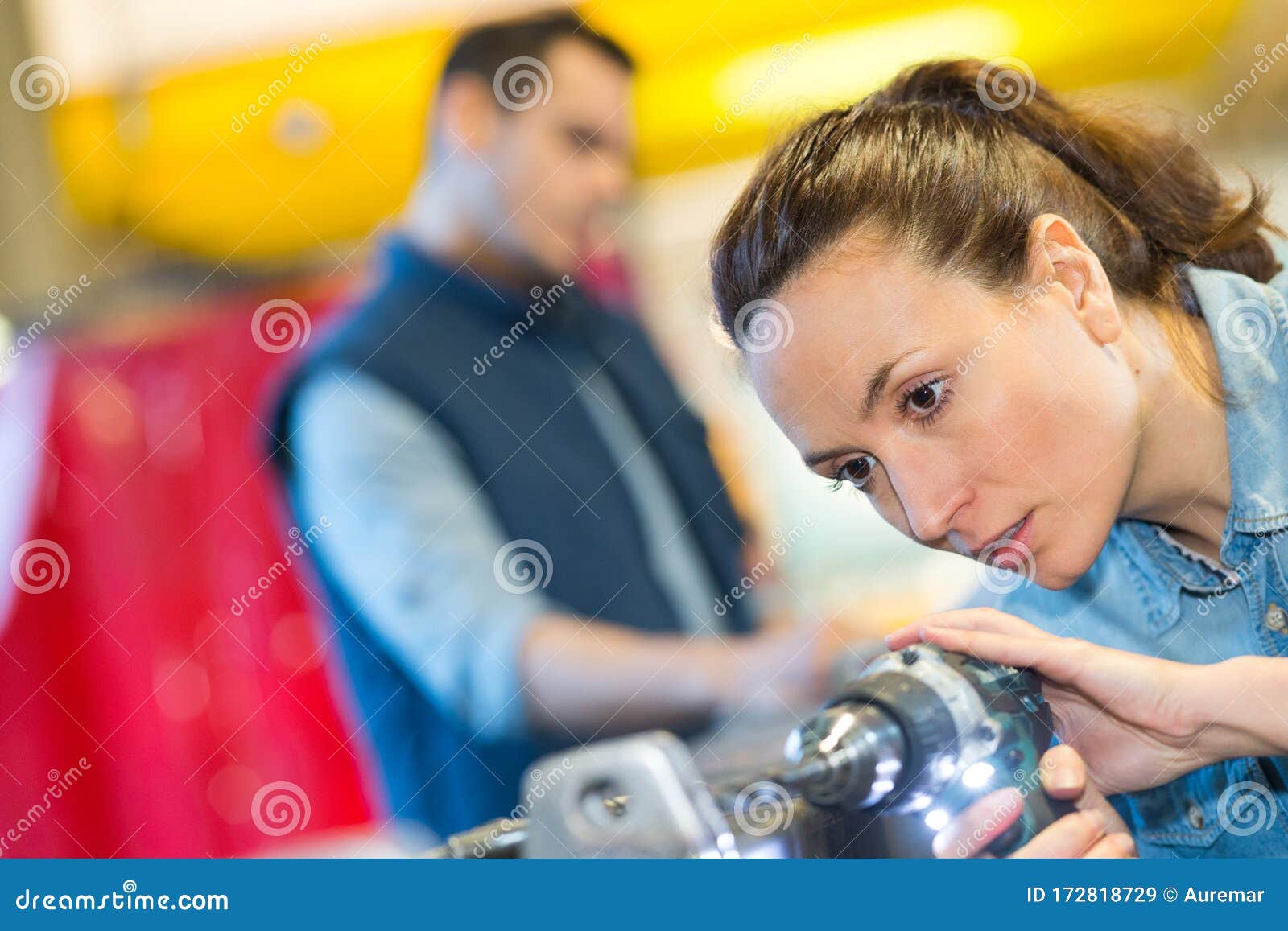 Female Apprentice Engineer Working on Drill in Factory Stock Image ...