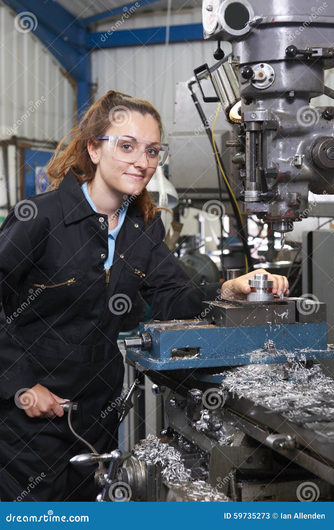 Female Apprentice Engineer Working on Drill in Factory Stock Image ...