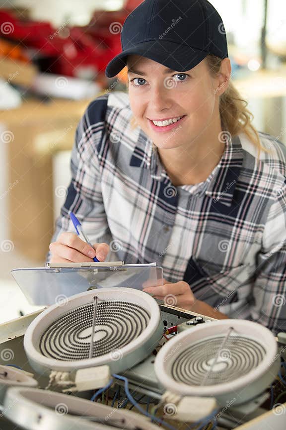 Female Apprentice Engineer Working on Machine Stock Image - Image of ...