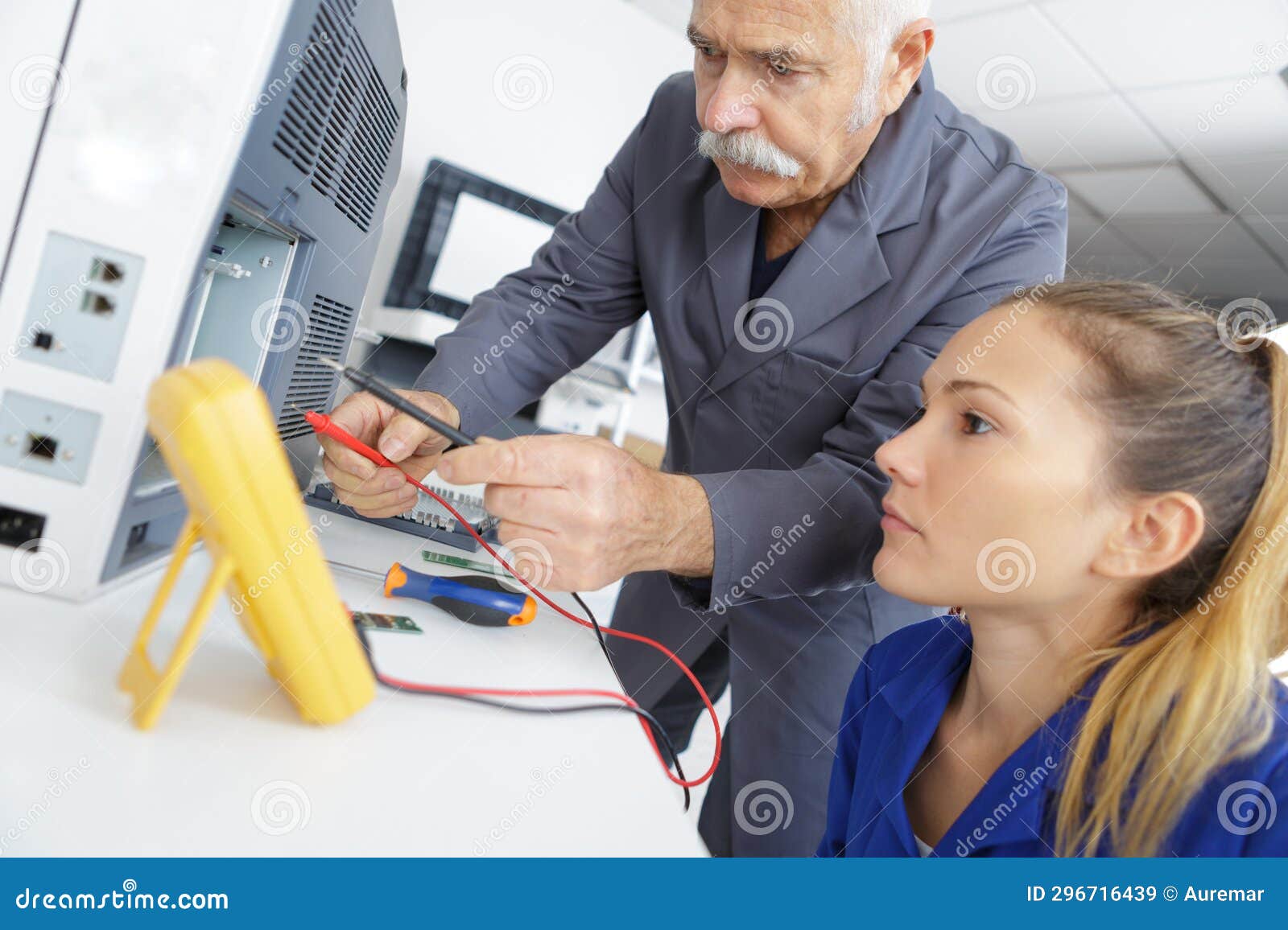 Female Apprentice Learning To Use Electronic Measuring Instruments Stock Image - Image of ...