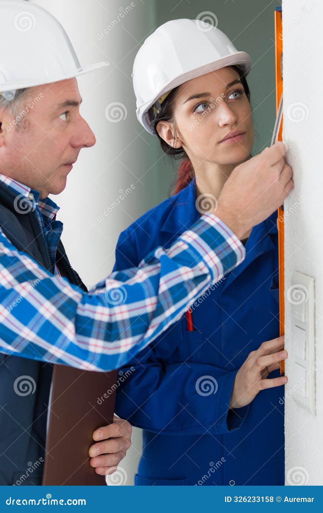 Female Apprentice and Master Working on Wall Stock Photo - Image of ...