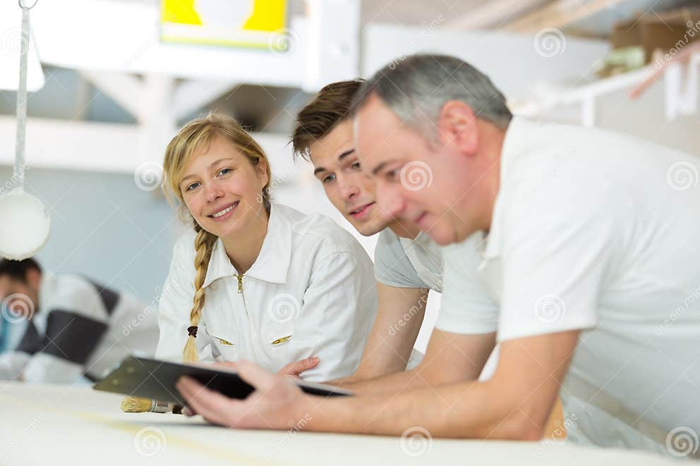 Female Apprentice Smiling while Posing Stock Photo - Image of ...