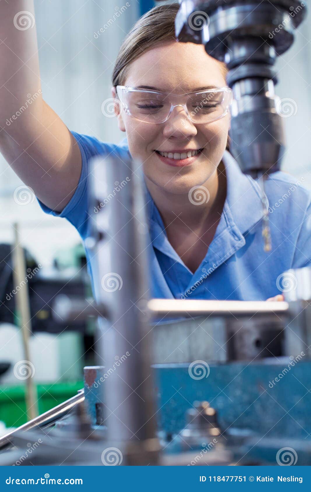 Female Apprentice Using Drill in Factory Stock Image - Image of ...