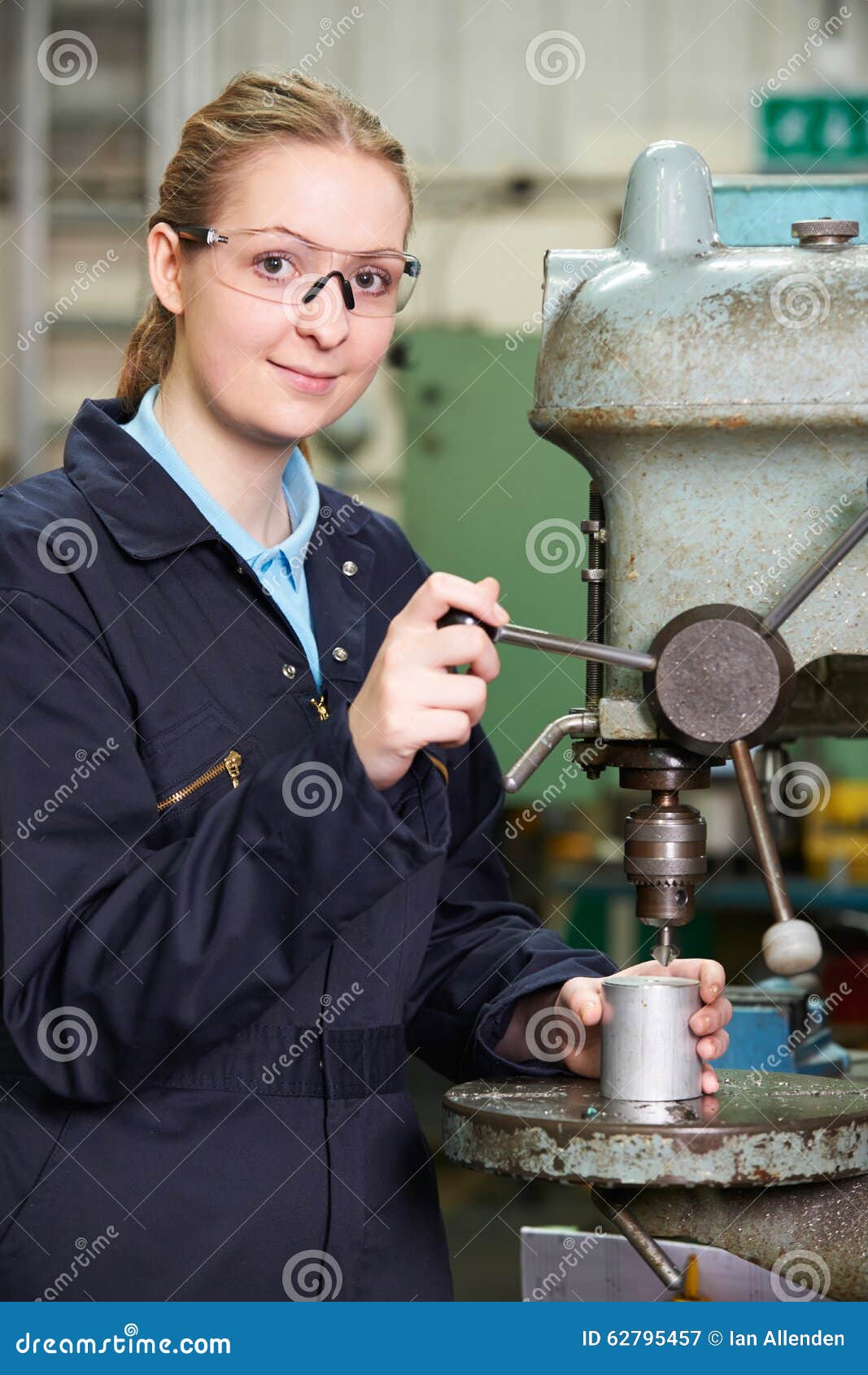 Female Apprentice Using Drill in Factory Stock Image - Image of woman ...