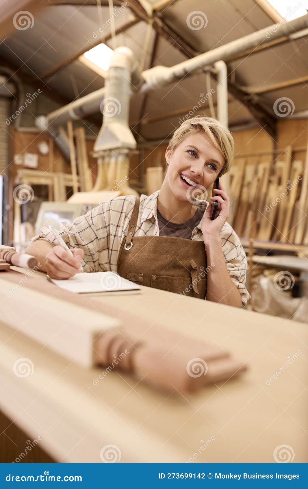 Female Apprentice Working As Carpenter in Furniture Workshop Making ...