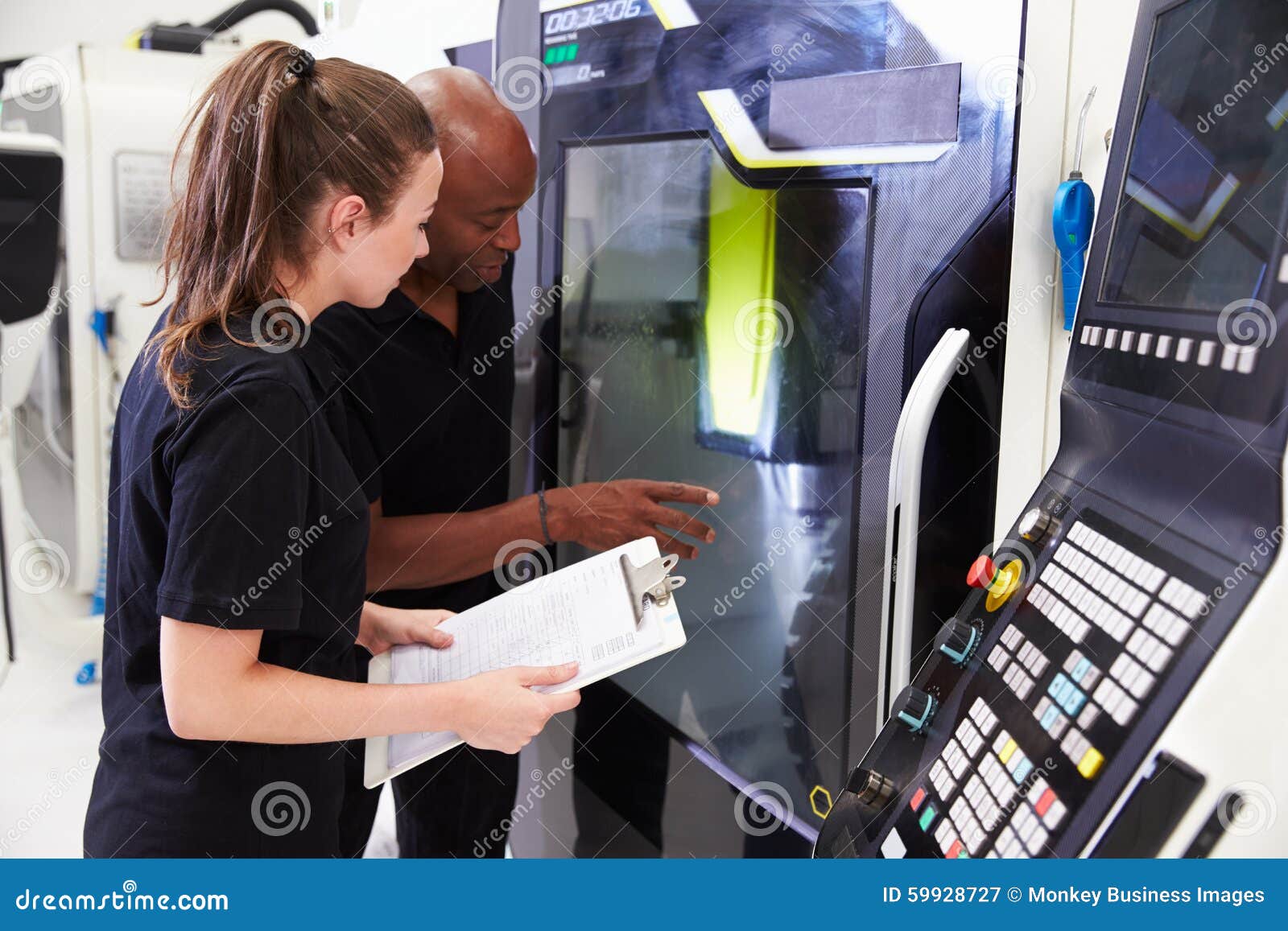 Female Apprentice Working with Engineer on CNC Machinery Stock Image ...