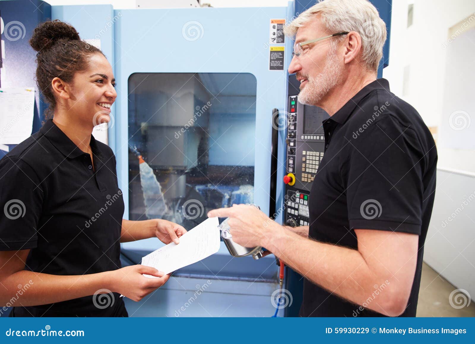 Female Apprentice Working with Engineer on CNC Machinery Stock Image ...