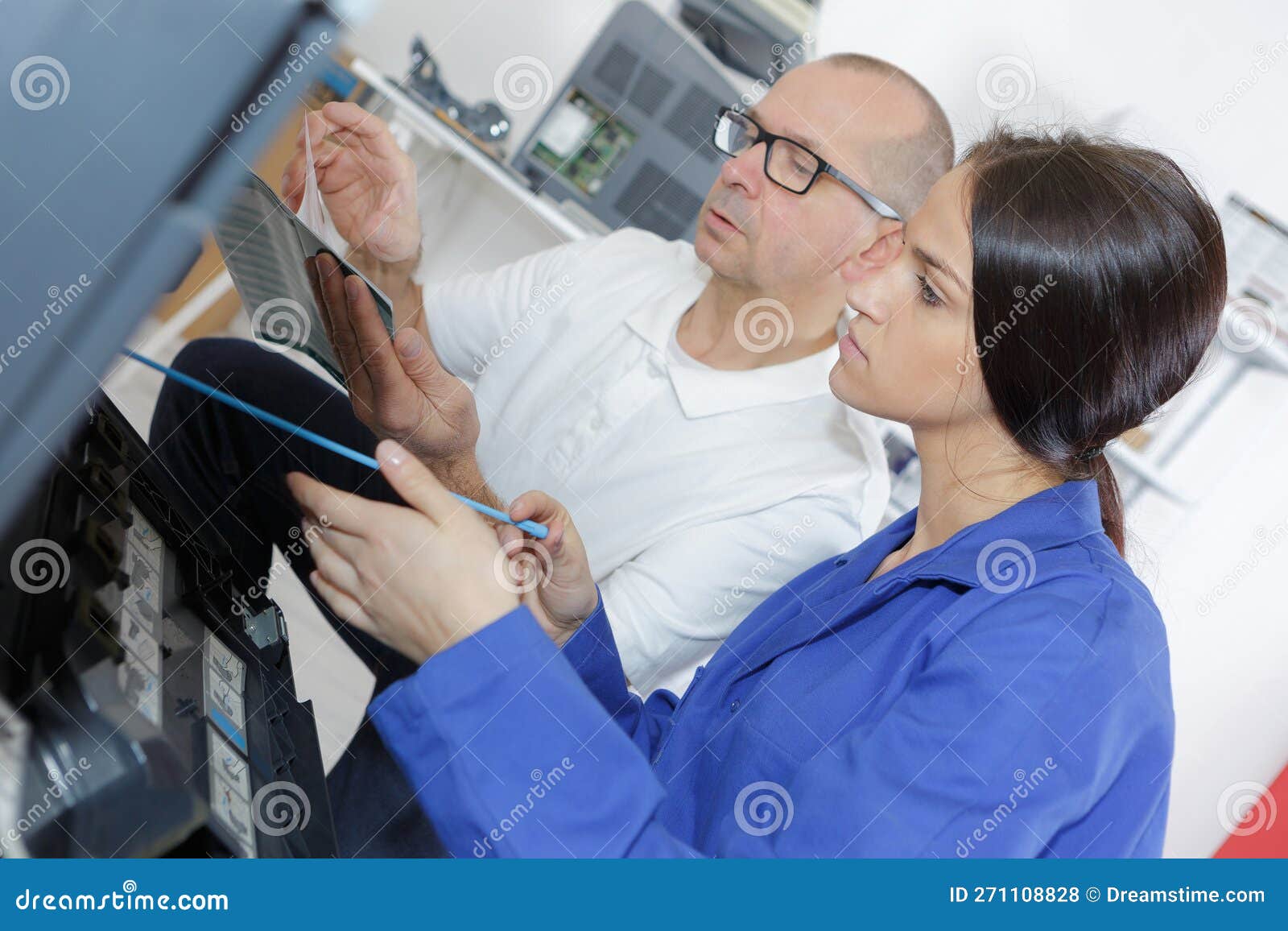 Female Apprentice Working on Machinery Stock Photo - Image of ...