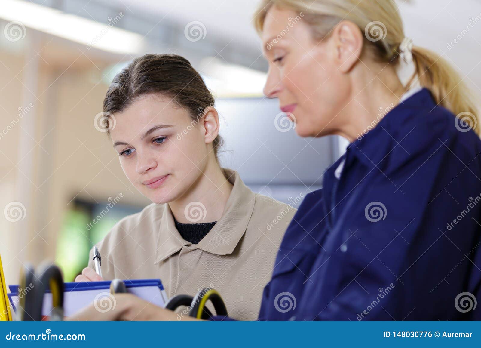 Female Apprentice Working with Mentor Stock Photo - Image of horizontal ...