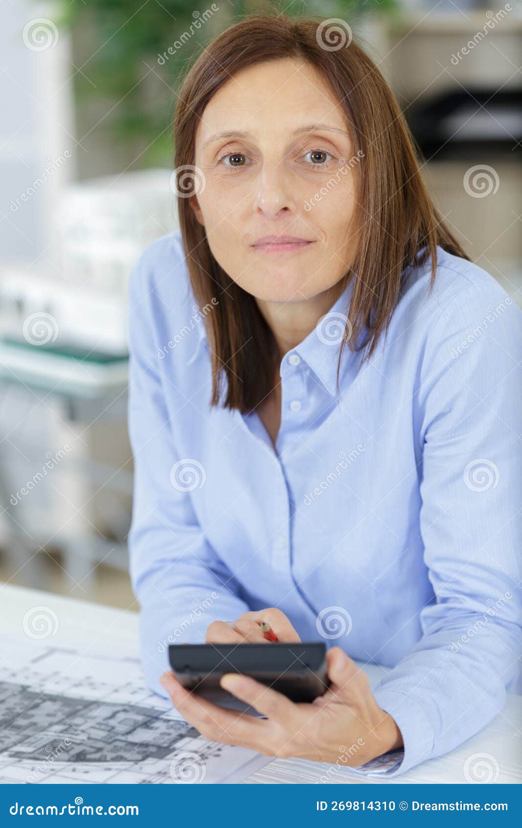 Female Architect with Calculator Stock Photo - Image of information ...