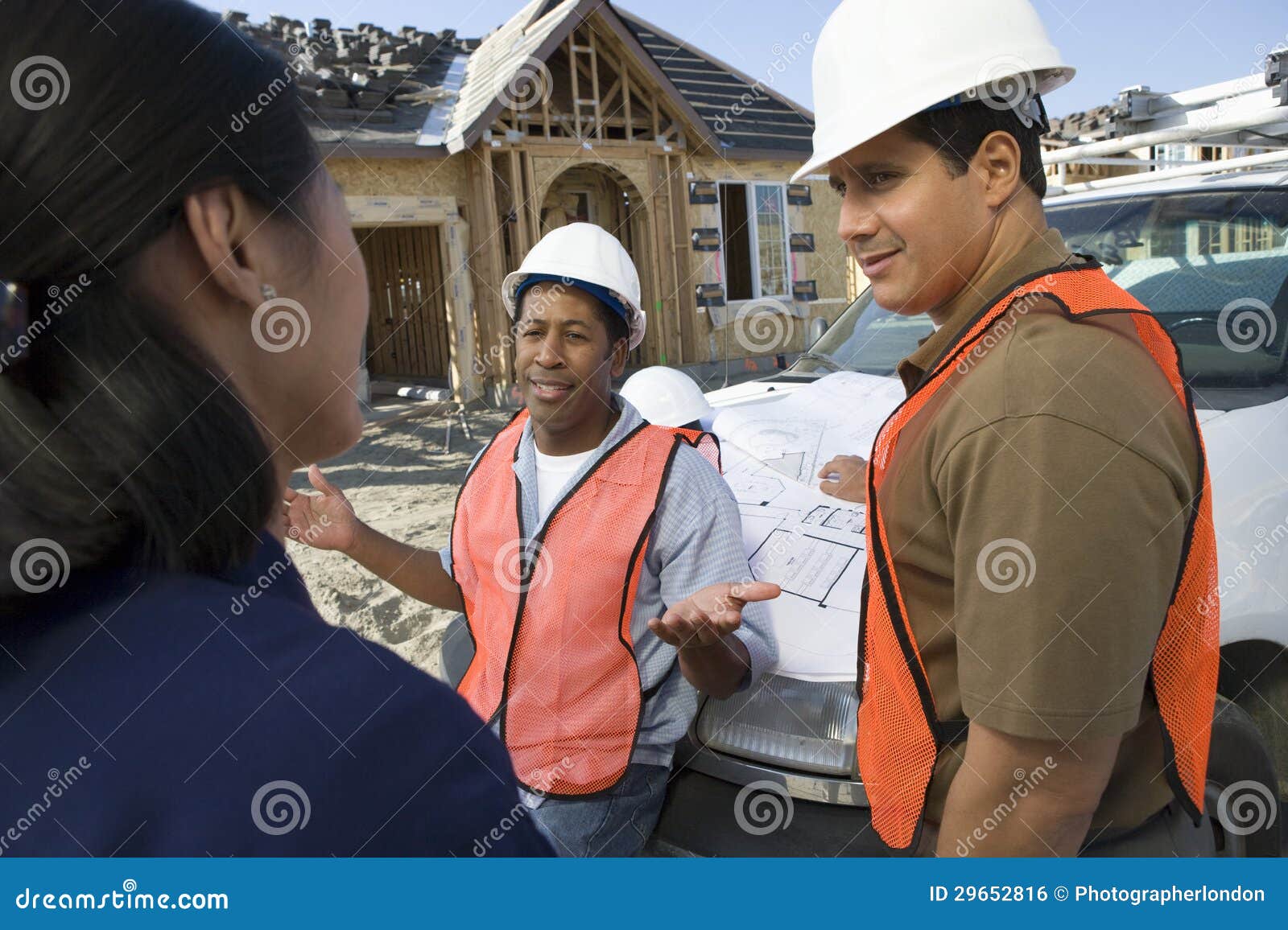 Female Architect in Discussion with Co-Workers Stock Photo - Image of ...