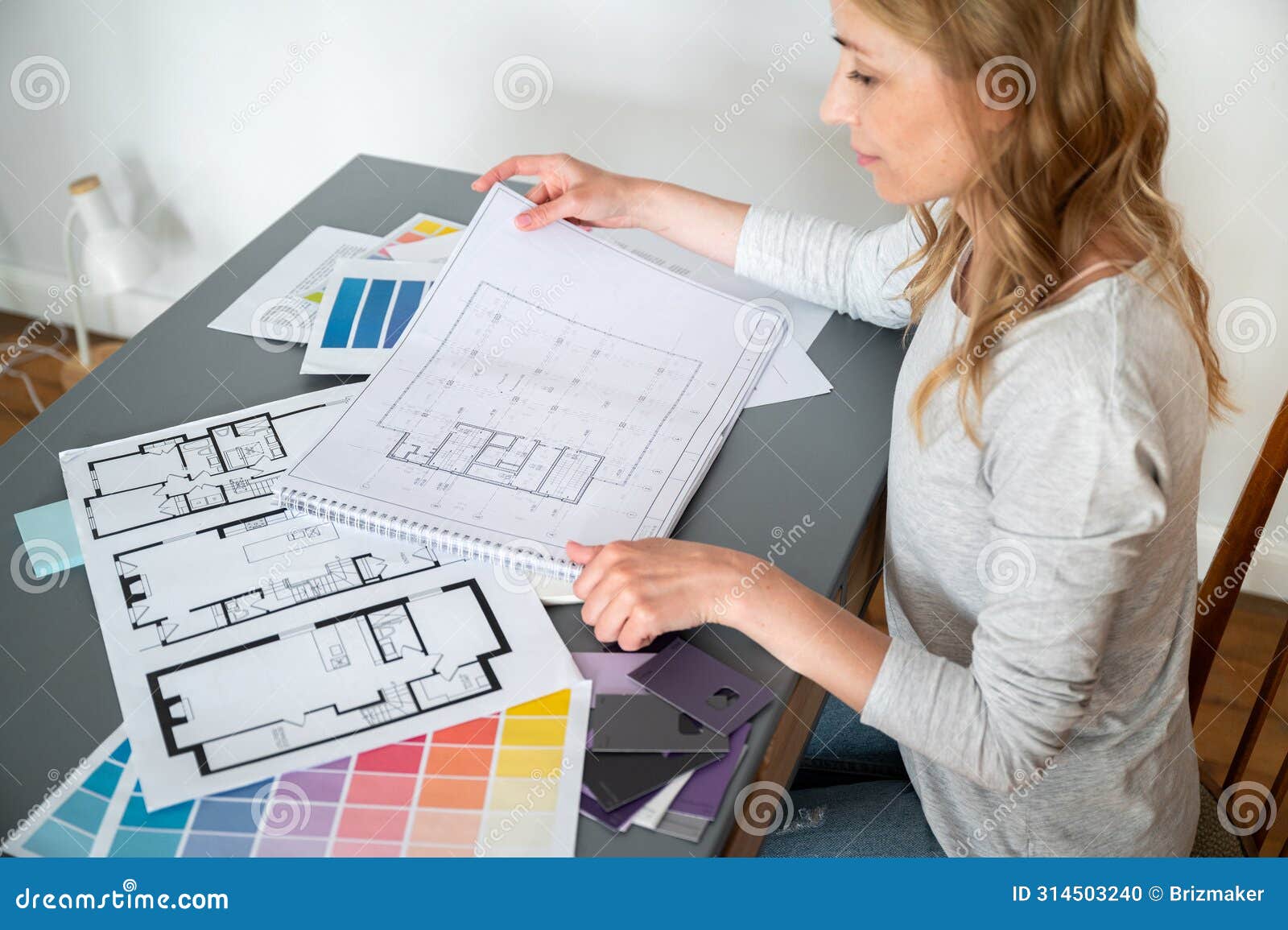 Female Architect Look at Blueprint, Reading Technical Drawing Stock ...