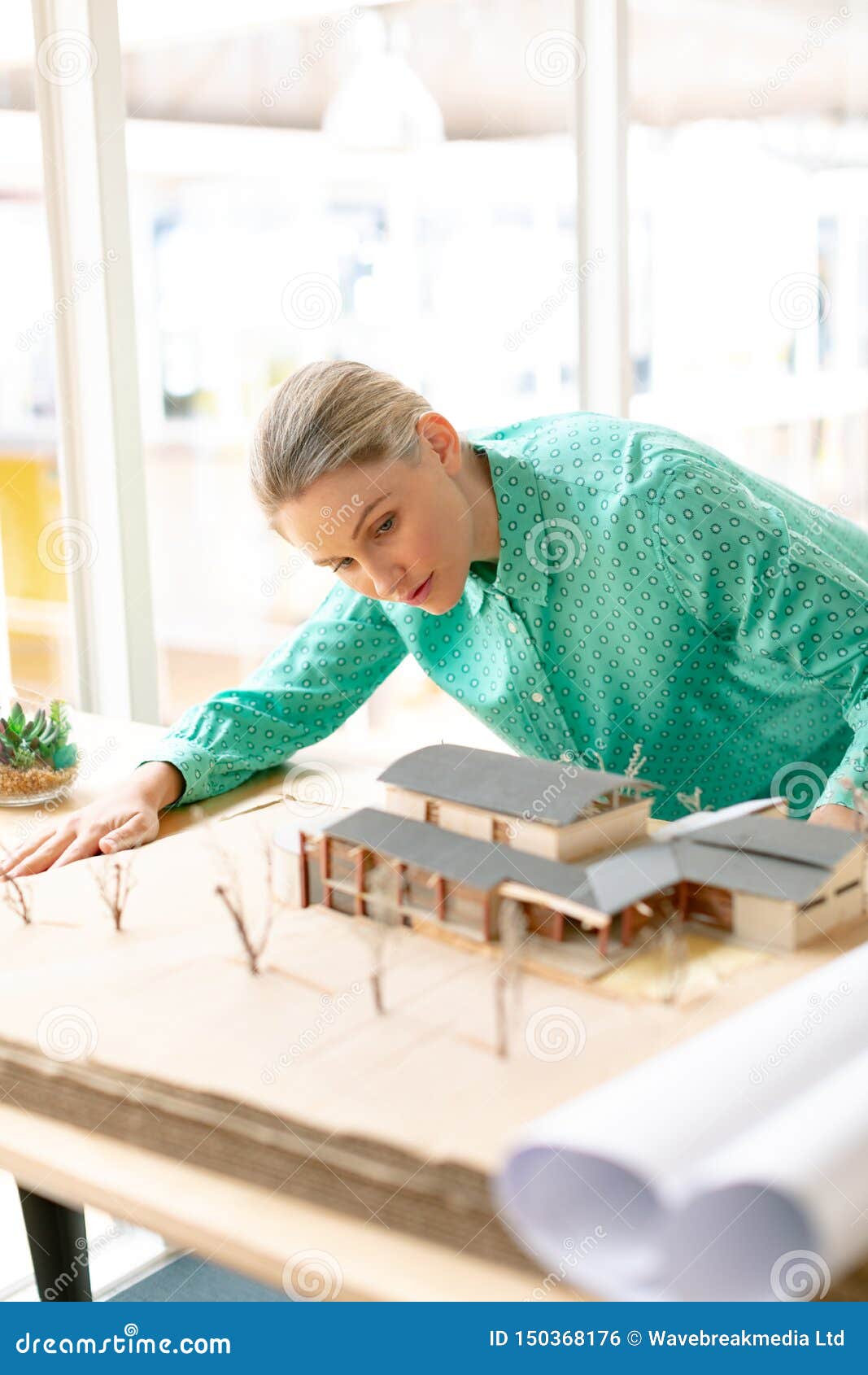 Female Architect Looking at Architectural Model Stock Photo - Image of ...